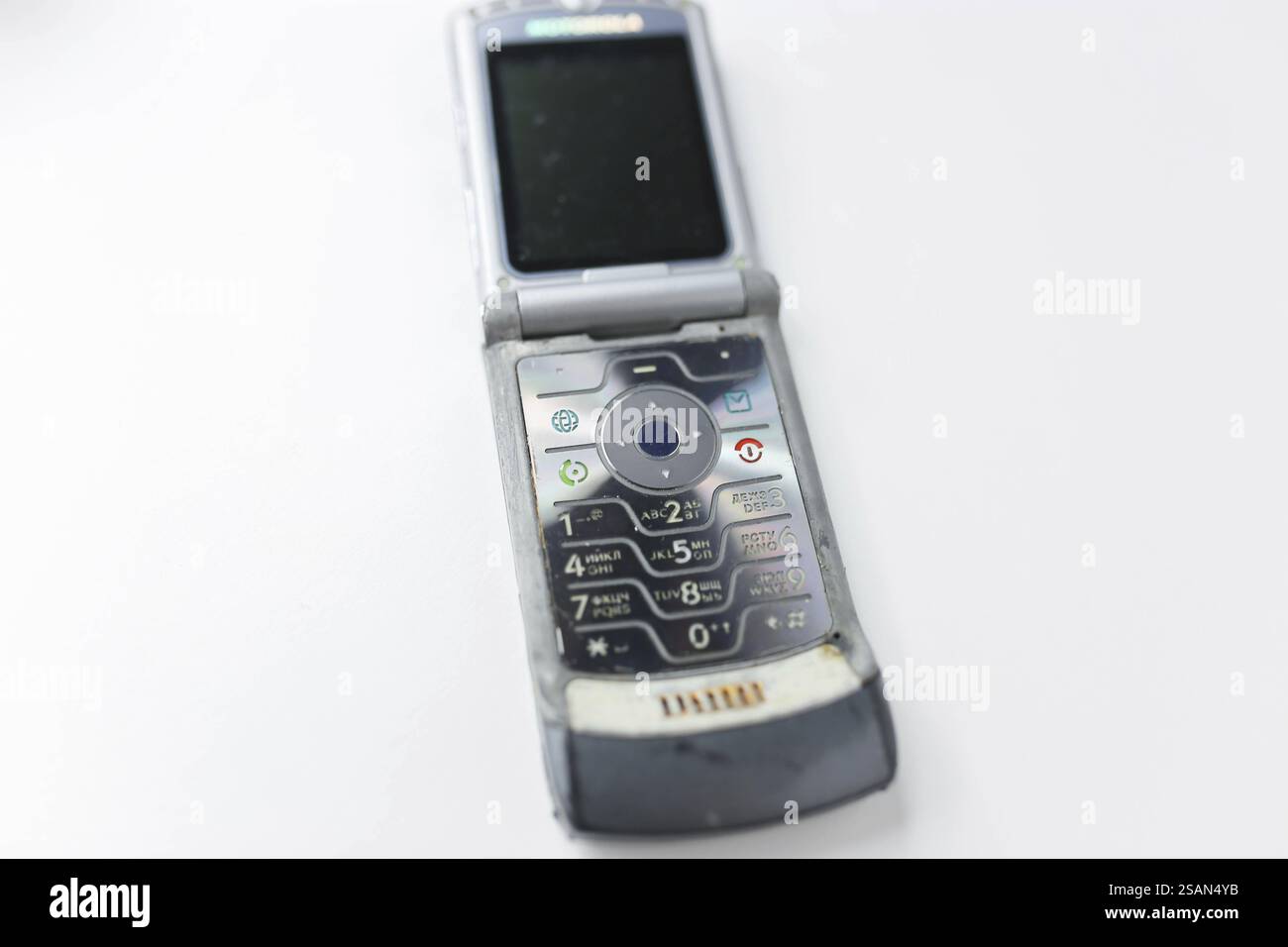 A vintage flip phone with an open keypad, showcasing classic mobile ...