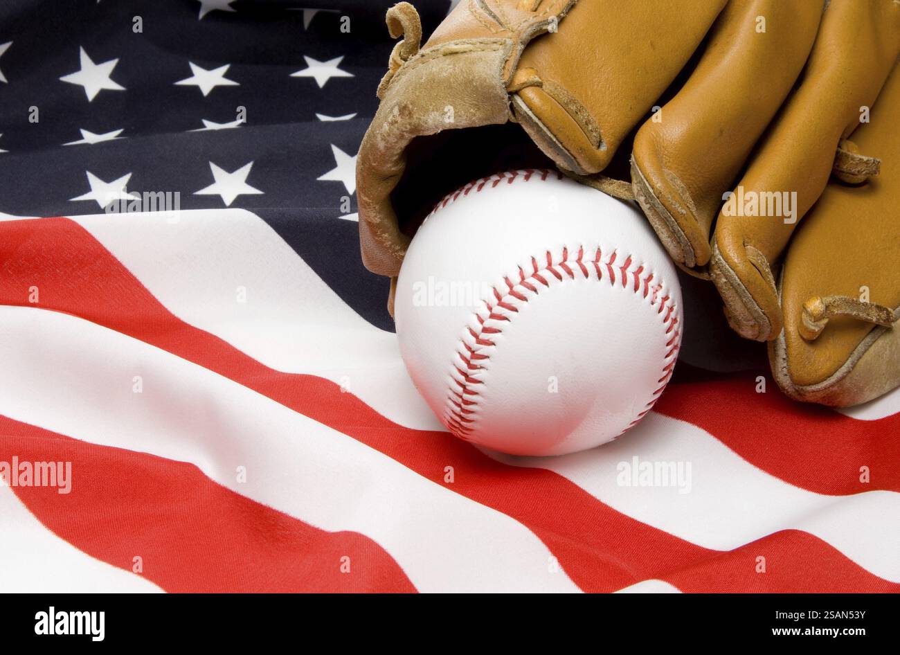 A Baseball and Glove on an American Flag Stock Photo - Alamy