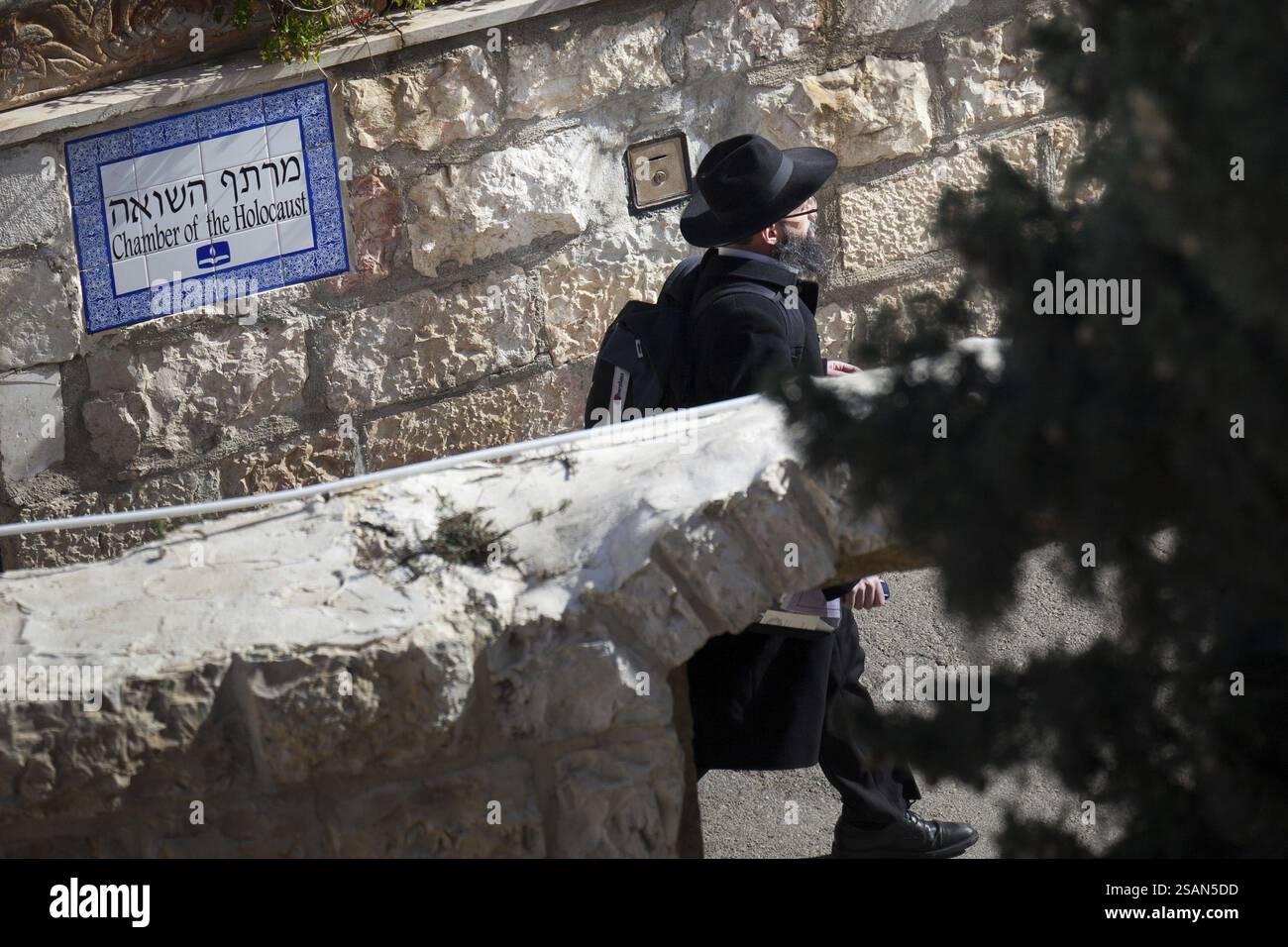 A Jewish man walking past the Chamber of the Holocaust museum in ...