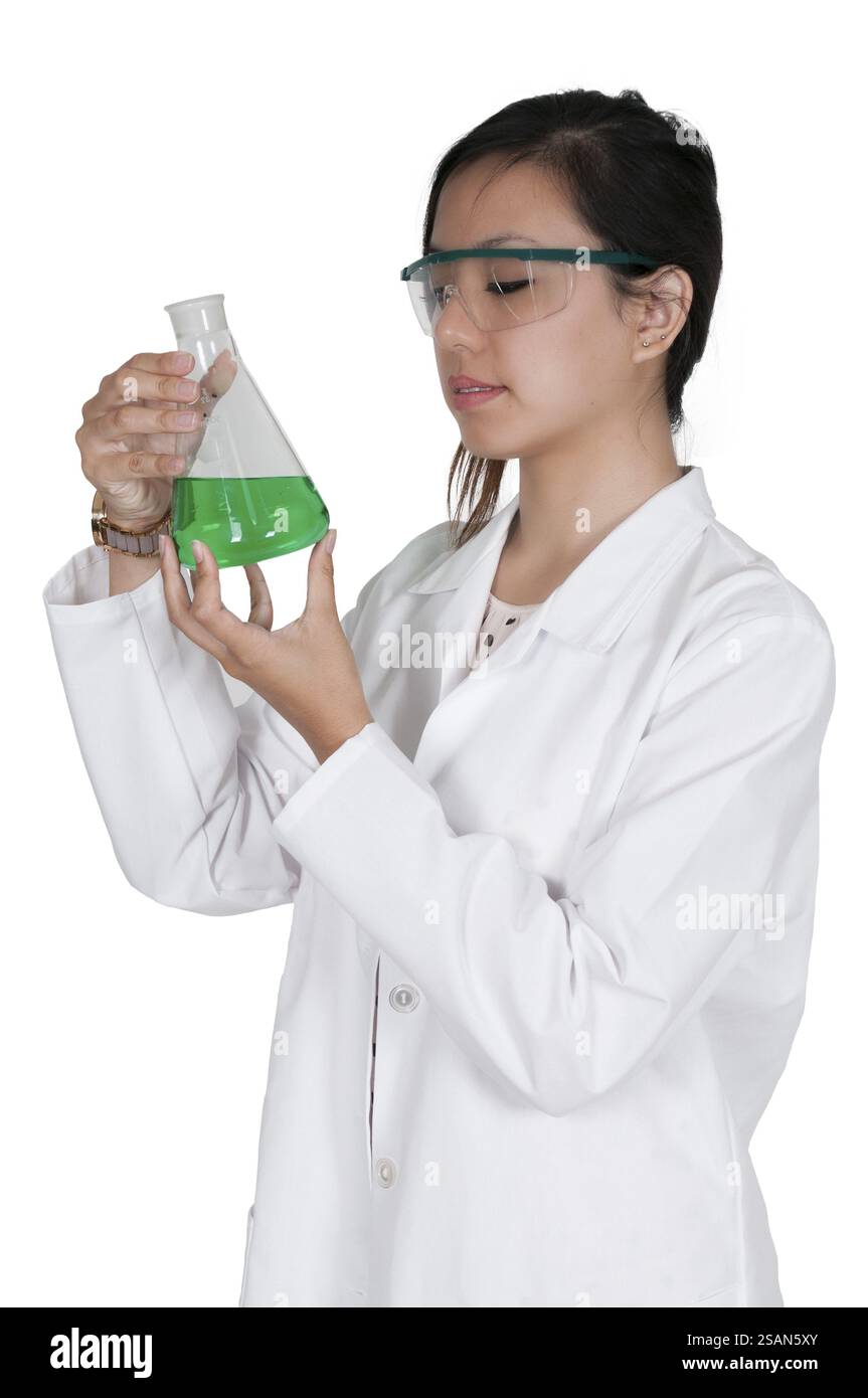 Beautiful woman scientist investigating a glass beaker Stock Photo - Alamy