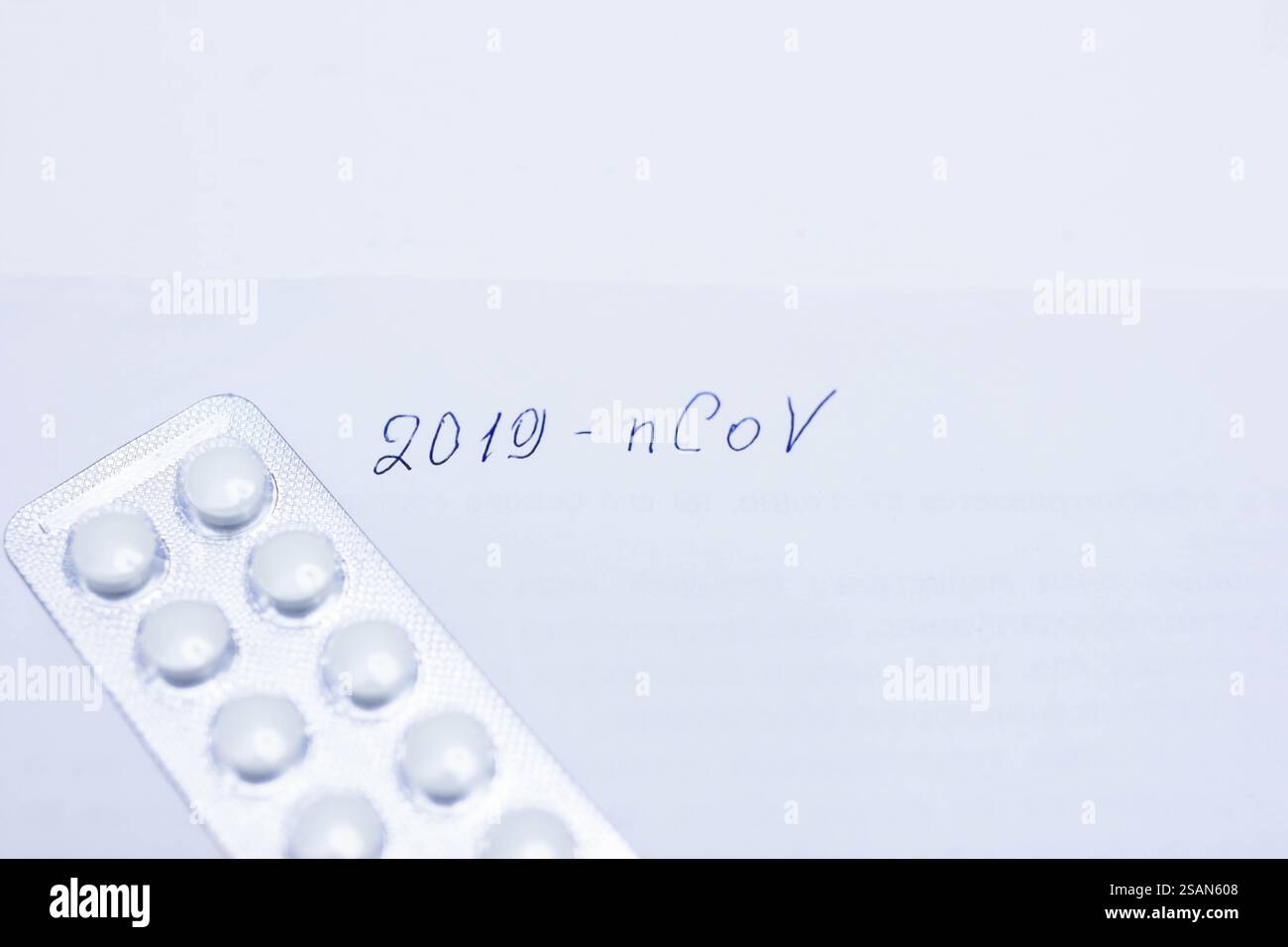 Blister pack beside a note with 2019 nCoV written on it Stock Photo - Alamy