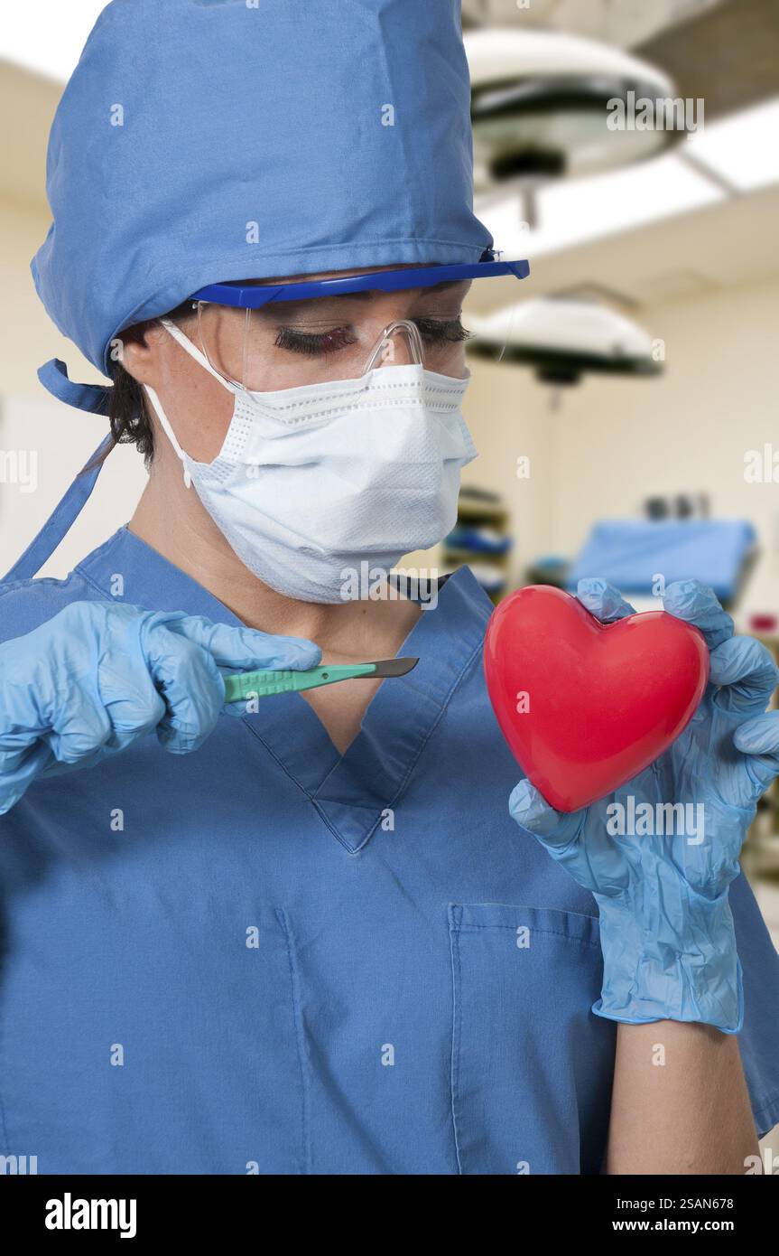 Beautiful young woman cardiology surgeon performing surgery Stock Photo ...