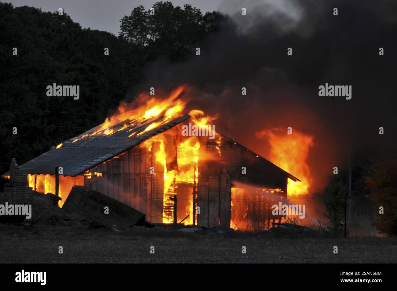 A building in the midst of being on fire Stock Photo - Alamy