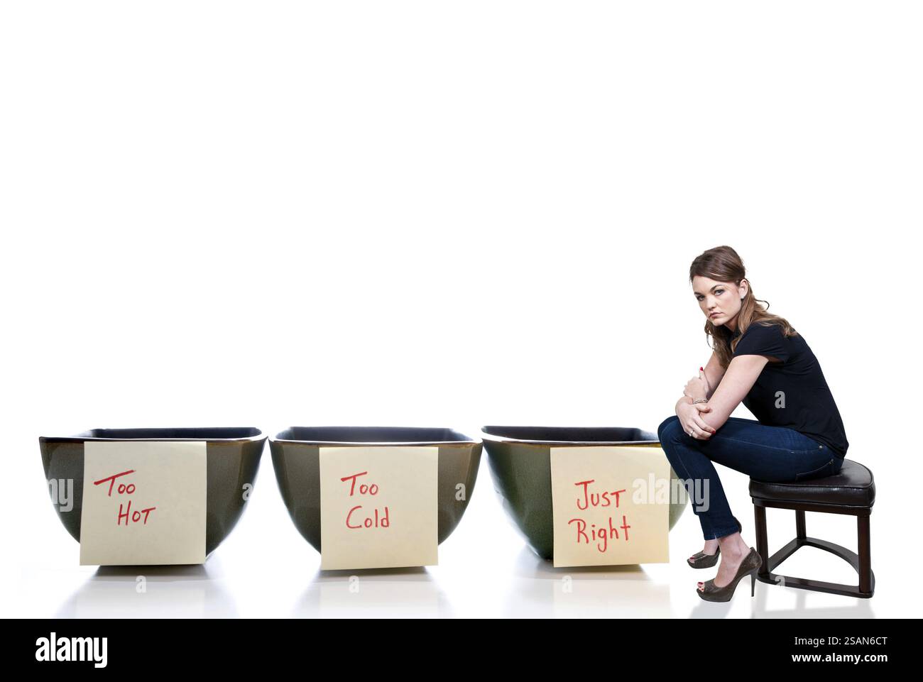 Beautiful Goldilocks woman with bowls of too hot, too cold and just ...