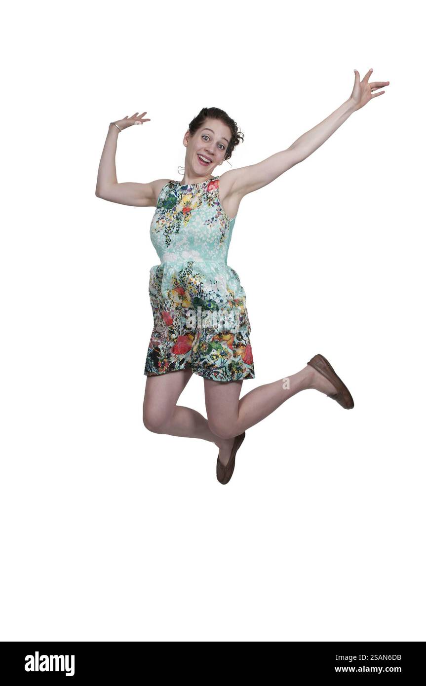Beautiful young woman jumping up for joy Stock Photo - Alamy