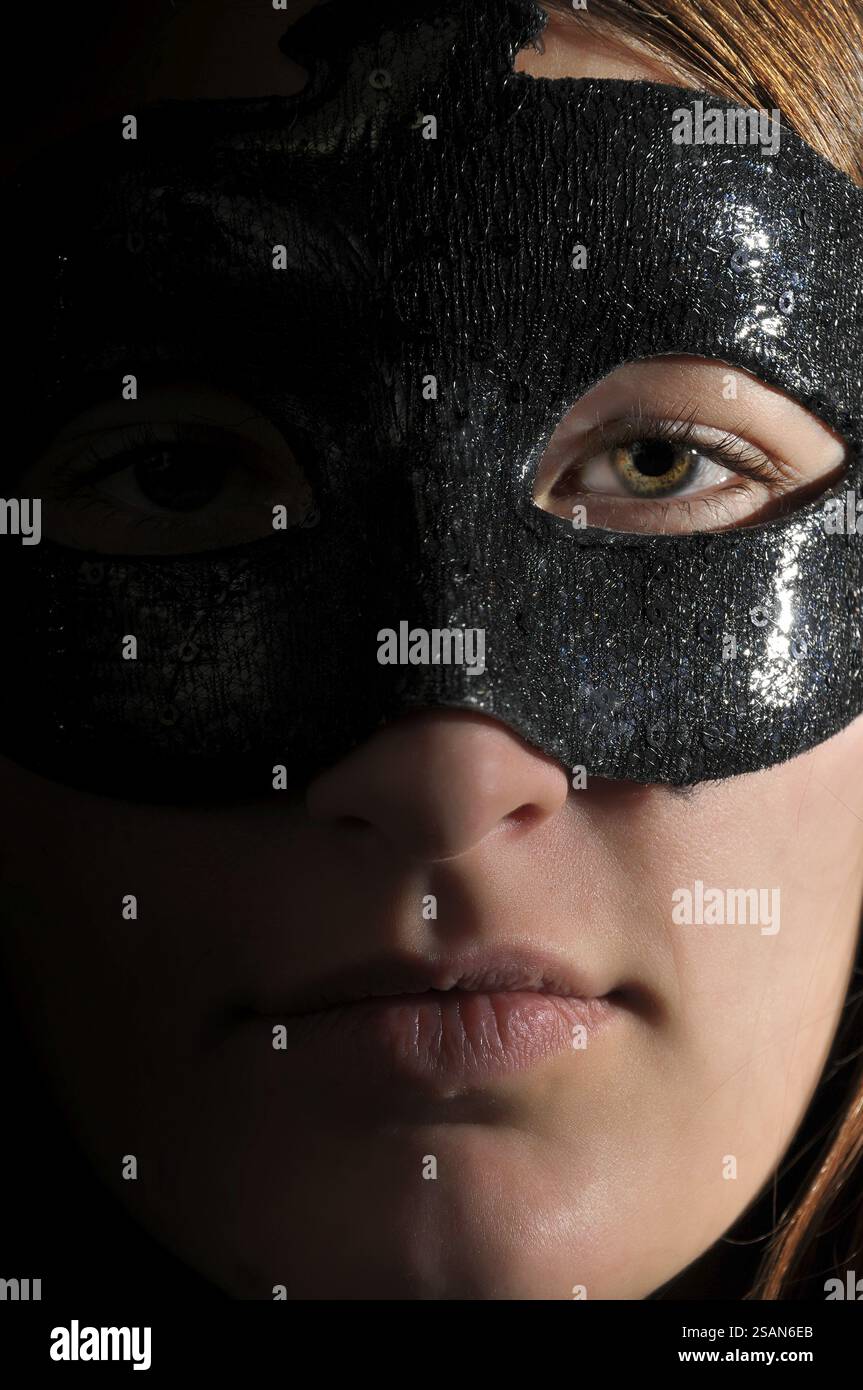 Beautiful woman wearing an interesting costume mask Stock Photo - Alamy
