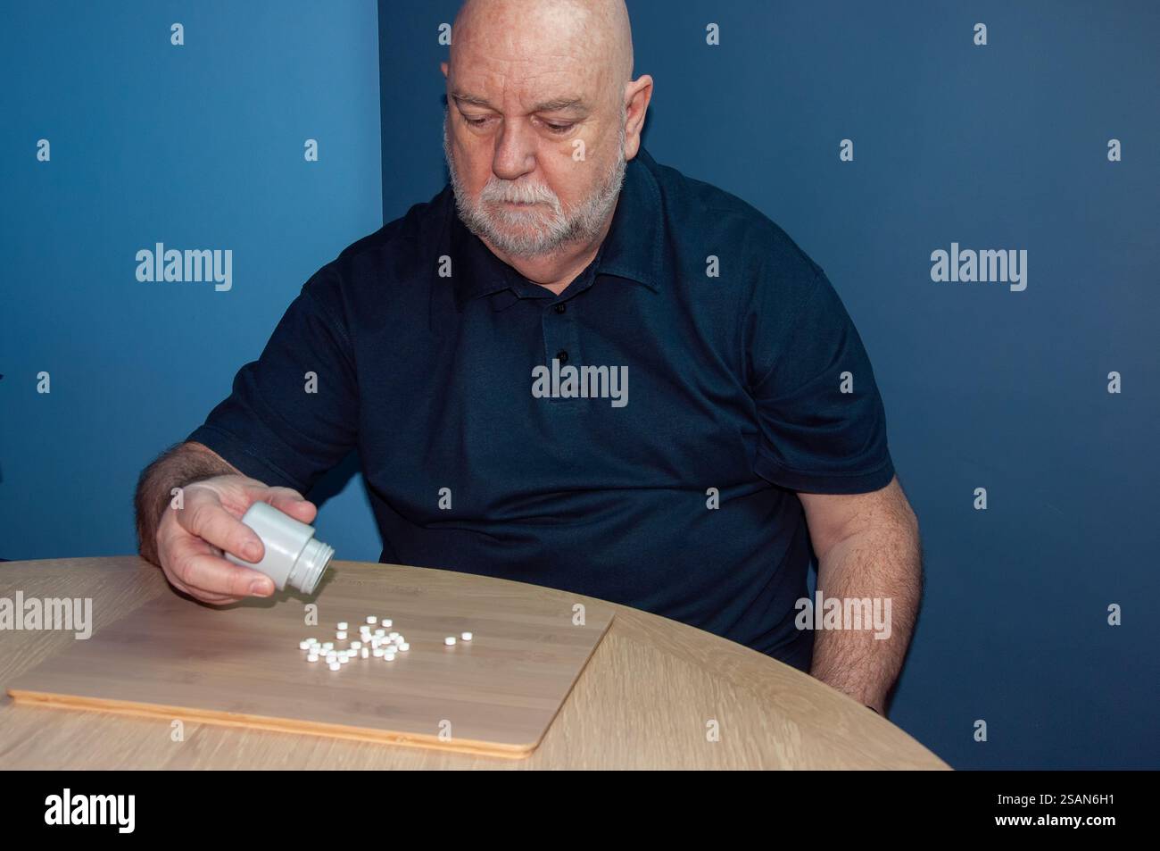 Man suffering health issues contemplating taking medication but he is ...