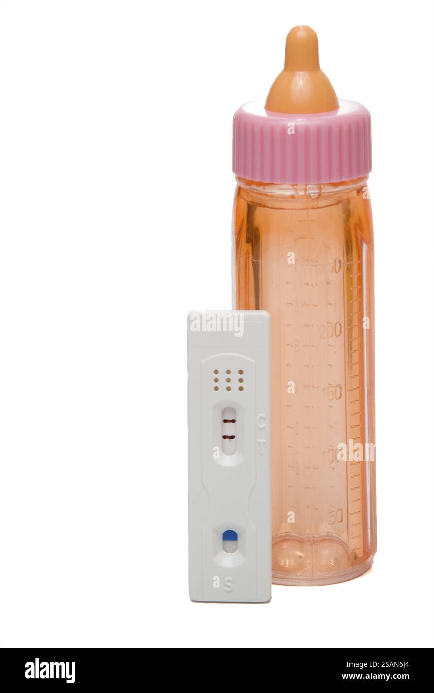 A Home Pregnancy Test and Baby Bottle Stock Photo - Alamy