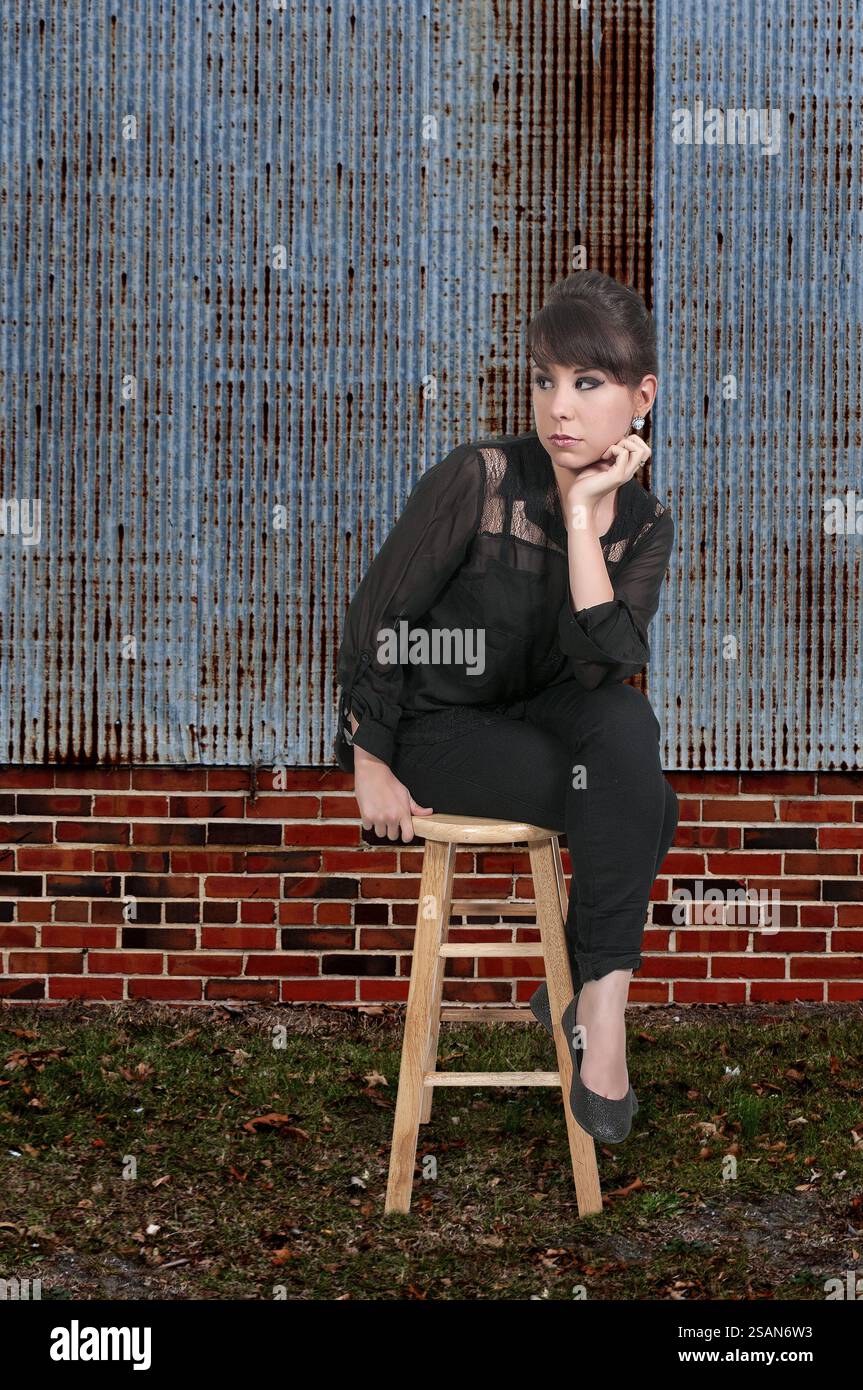 Beautiful young attractive woman modeling a pose Stock Photo - Alamy