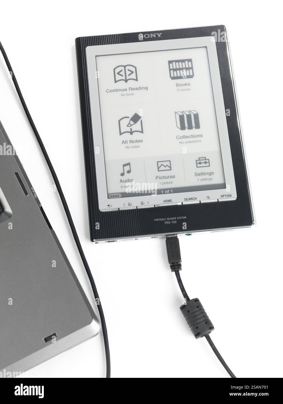 Sony Reader connected to a laptop computer via USB. PRS-700 Portable ...