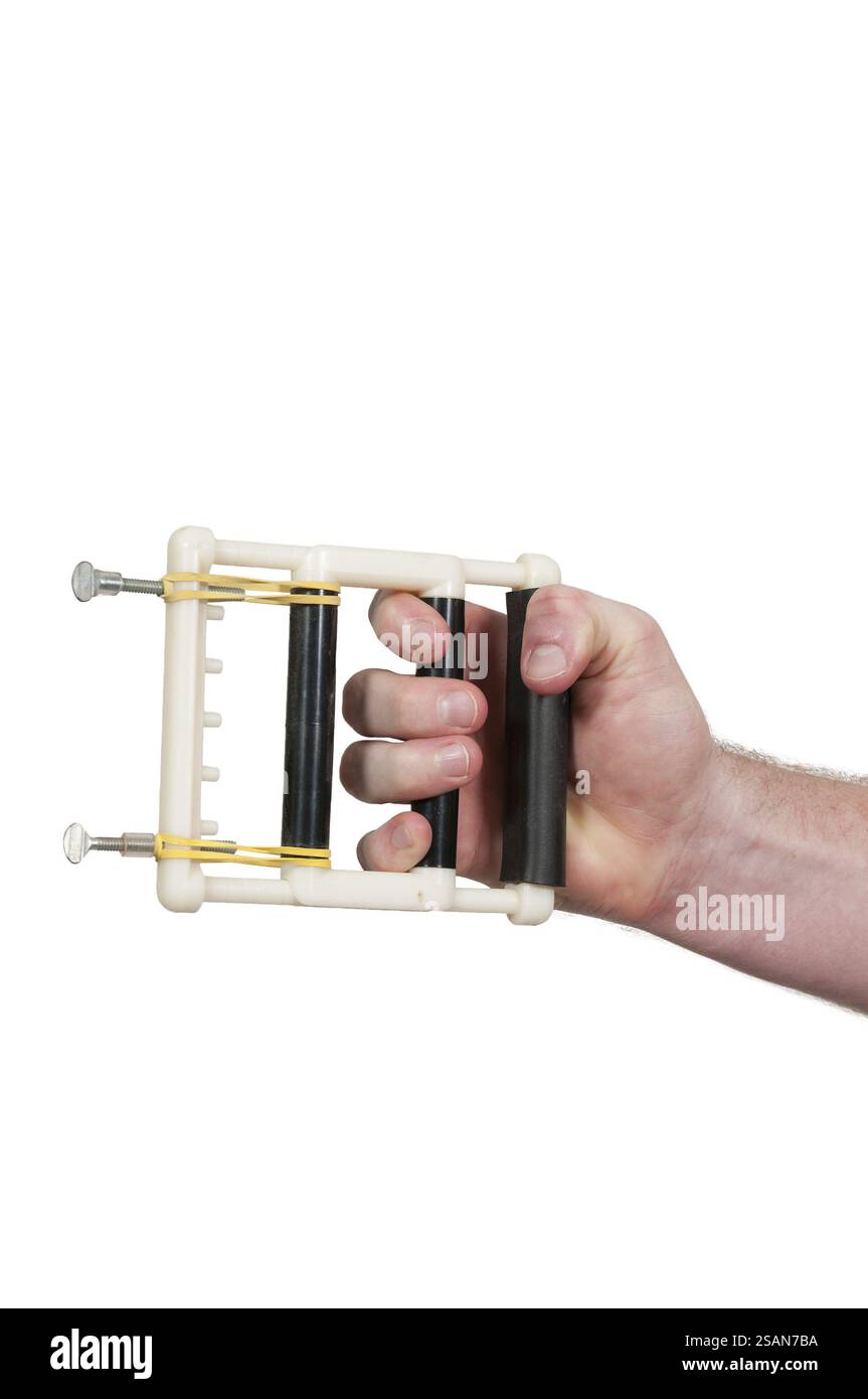 Man using a hand grip exerciser for strength Stock Photo - Alamy