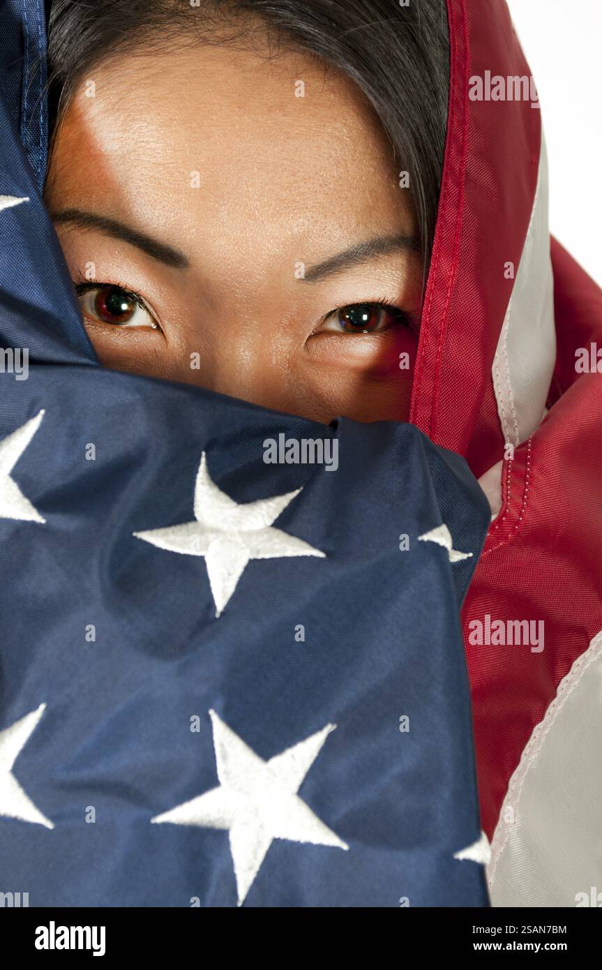 An Arab woman wrapped in an American flag Stock Photo - Alamy