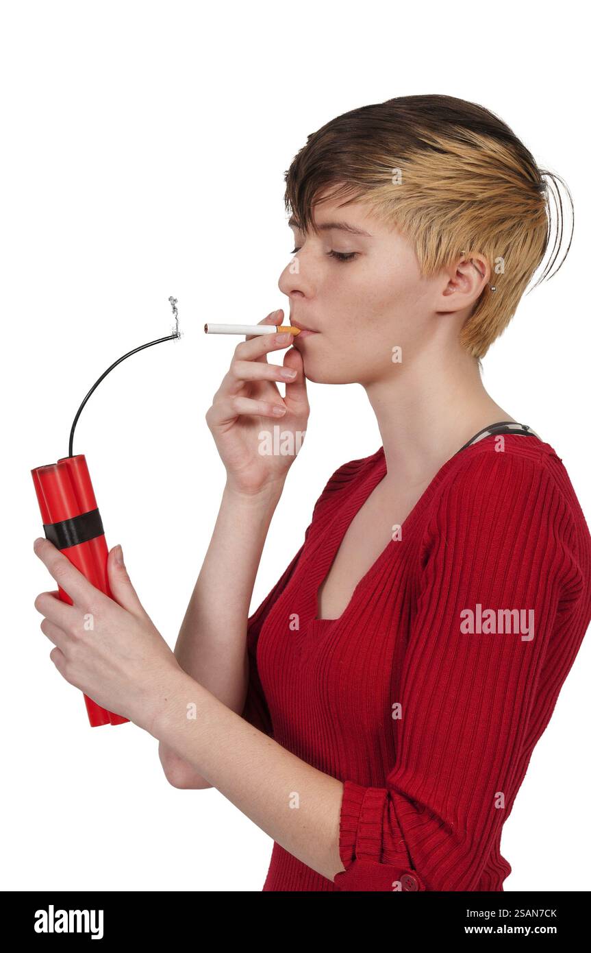 Beautiful woman lighting a cigarette with dynamite Stock Photo - Alamy