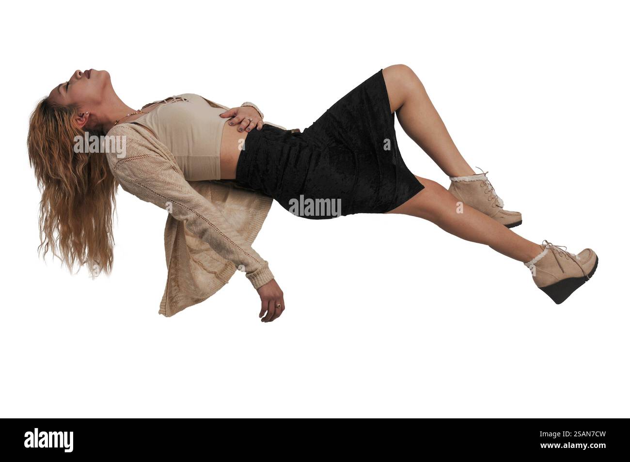 Beautiful young woman floating in the air Stock Photo - Alamy