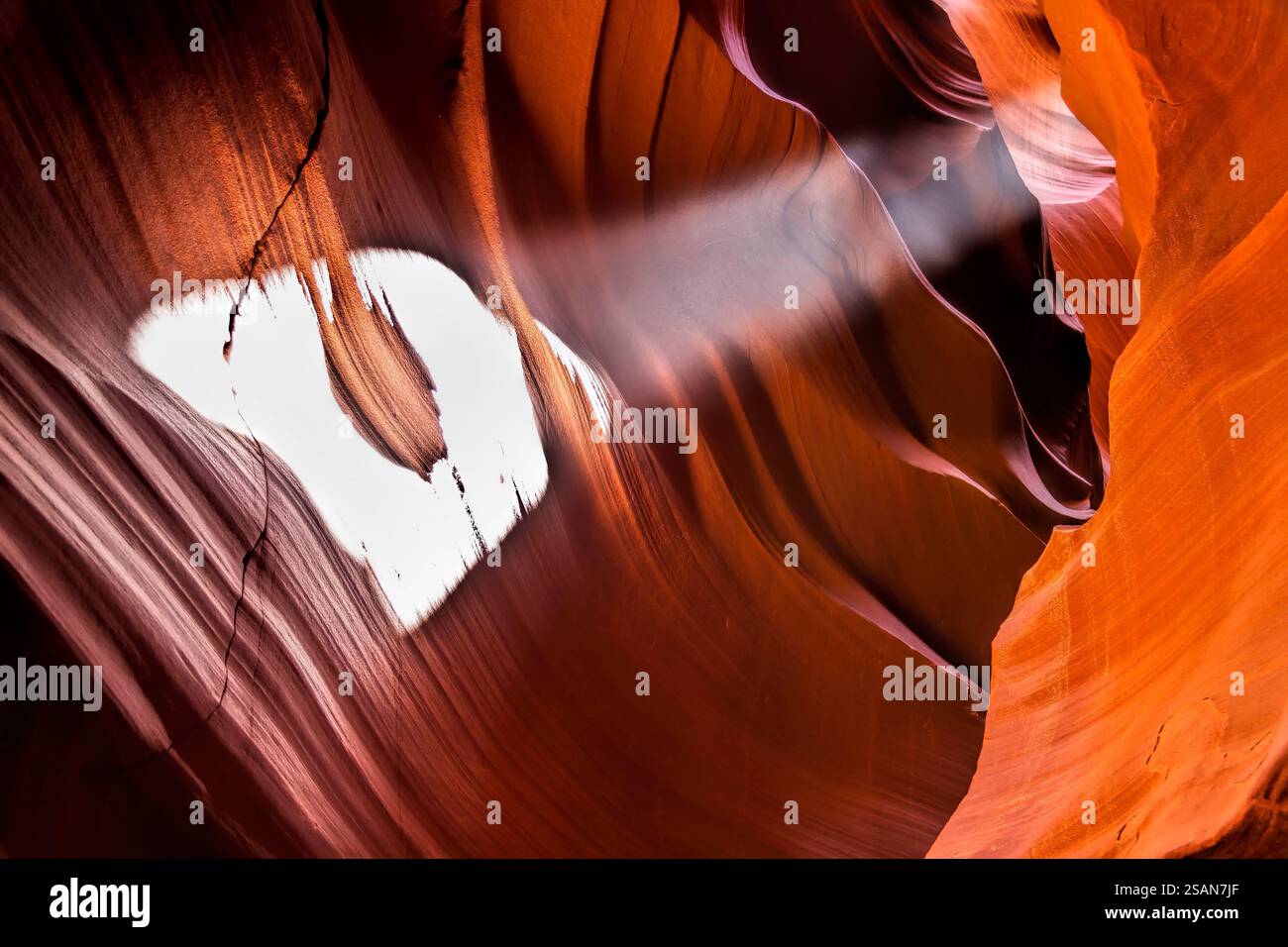 A canyon with a white shadow on the wall. The shadow is in the shape of ...