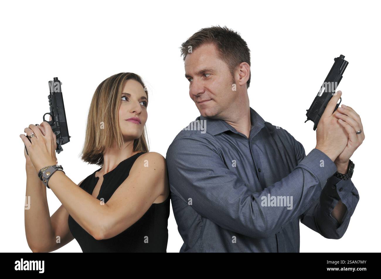 Man and woman secret agent spies with guns Stock Photo - Alamy