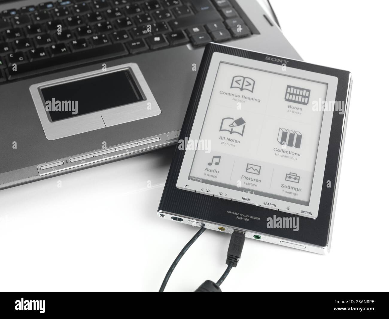 Sony Reader connected to a laptop computer via USB. PRS-700 Portable ...