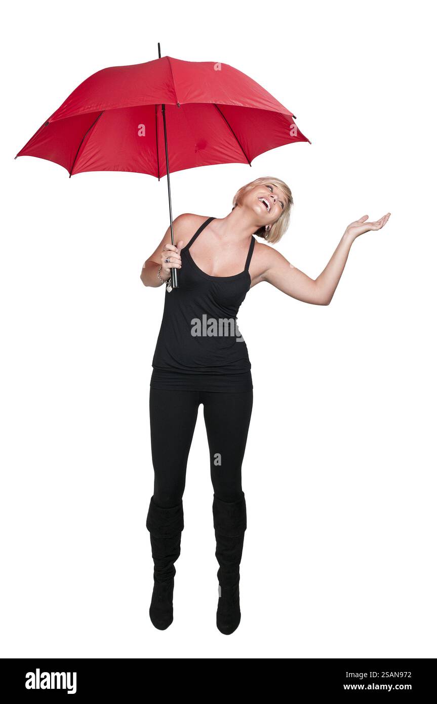 Umbrella in the wind hi-res stock photography and images - Alamy