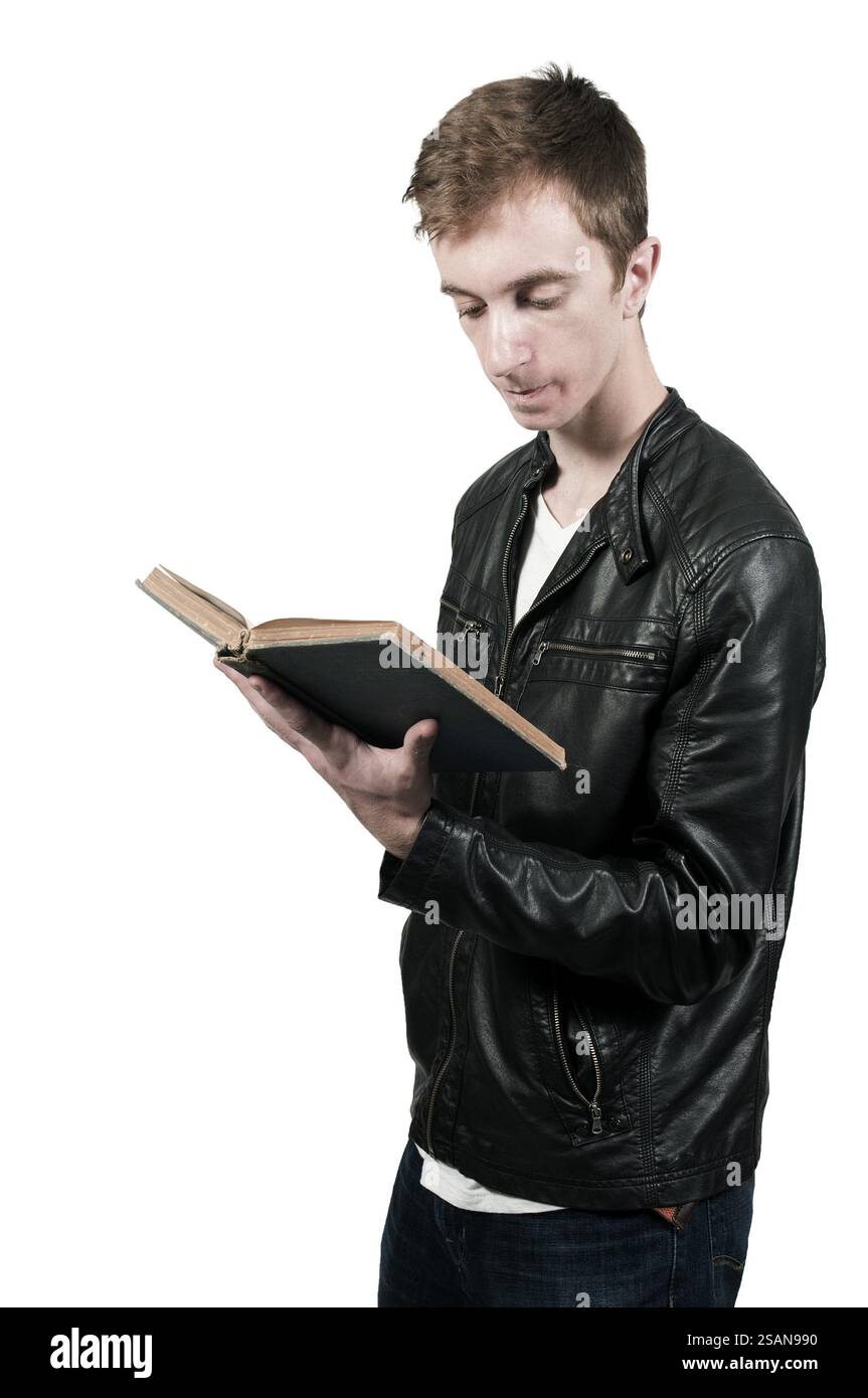Young handsome man busy reading a book Stock Photo - Alamy