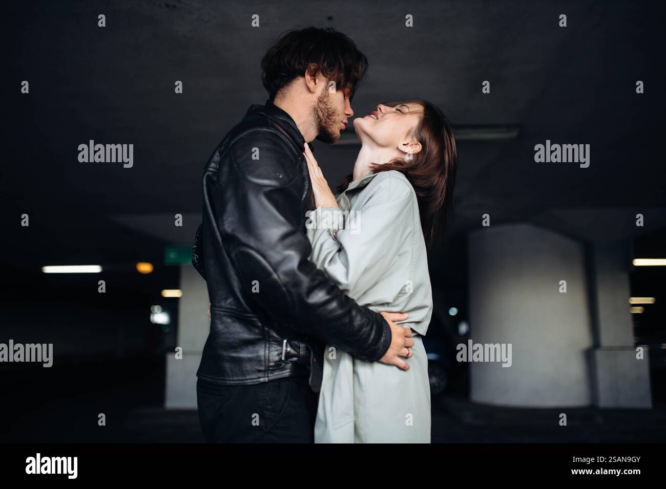 A sense of longing pervades as the couple leans in, capturing an ...