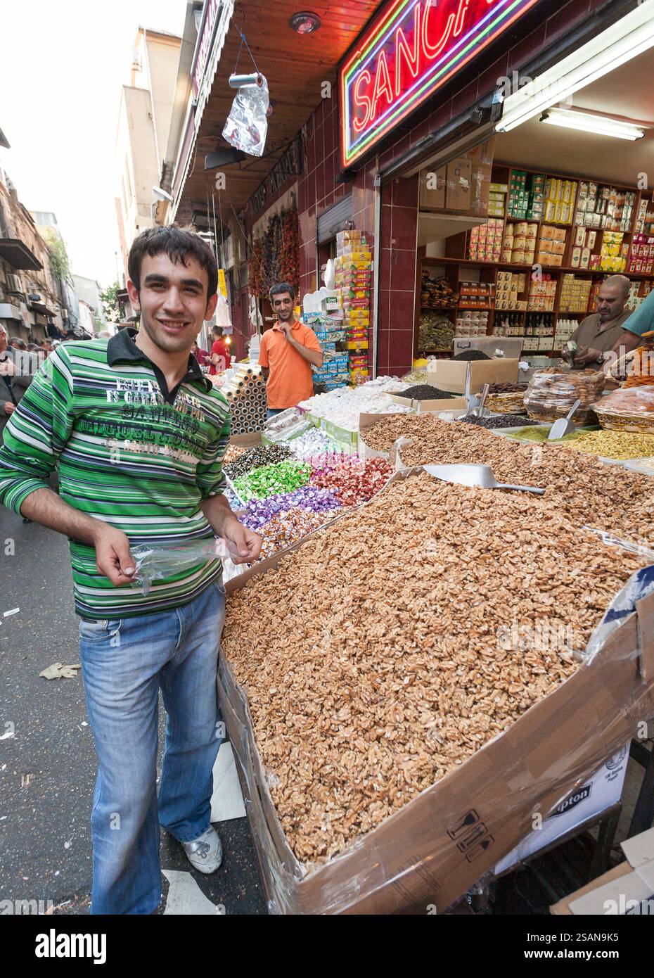 Walnut Vendor and his walnuts: A young man sells walnuts from a ...