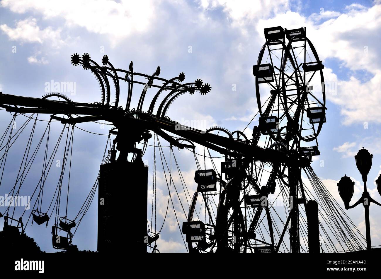 Exciting fair rides at an amusement park Stock Photo - Alamy