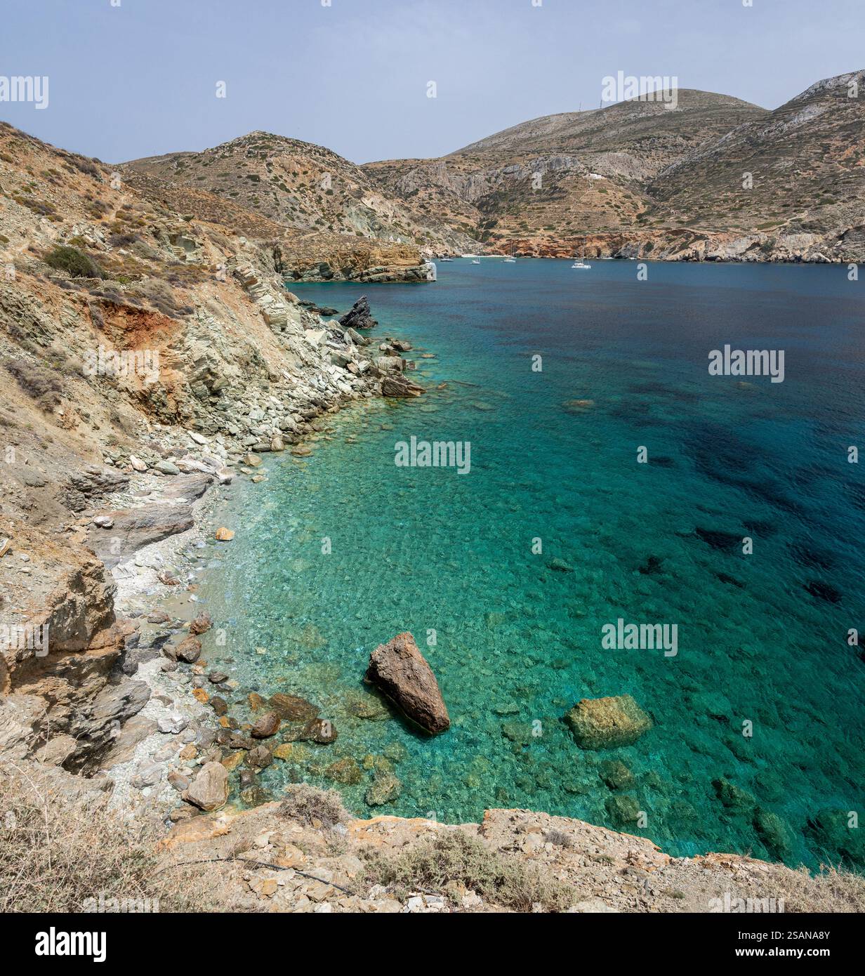 Clear Water Arid hills of Folegandros: The dry and rocky shoreline ...