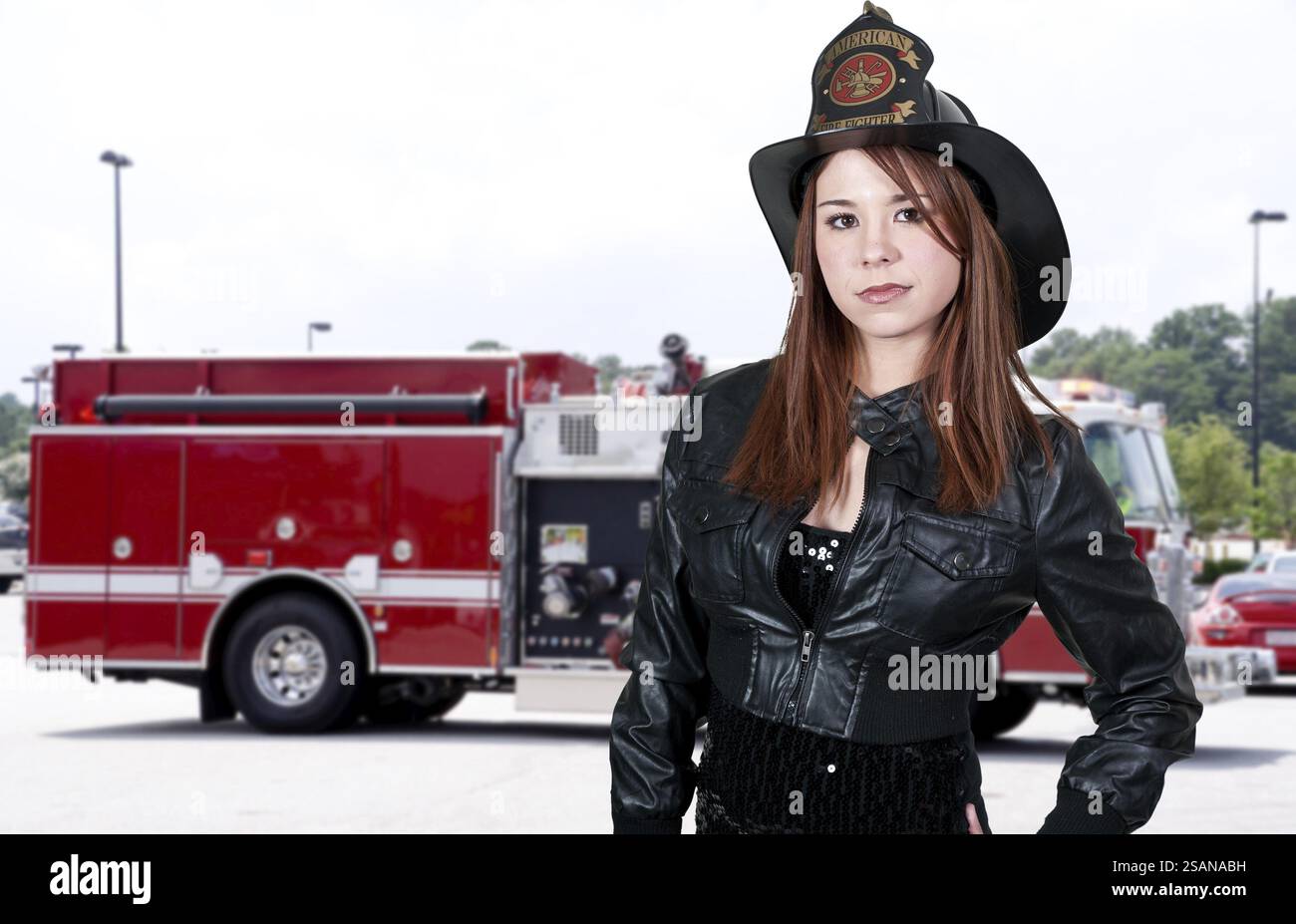 A beautiful woman firefighter at a fire Stock Photo - Alamy