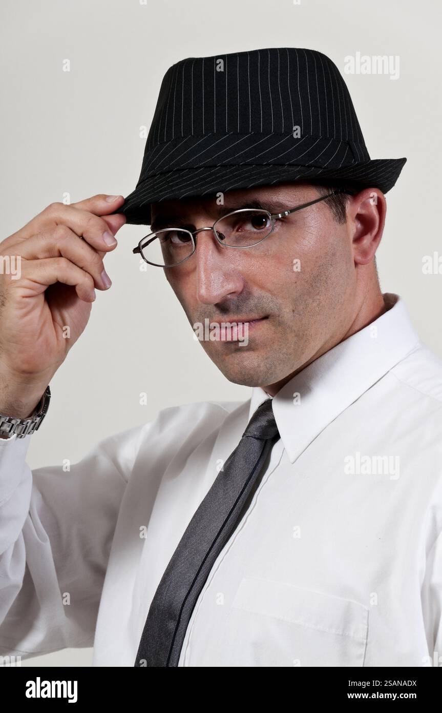 Attractive handsome man in a fedora hat Stock Photo - Alamy