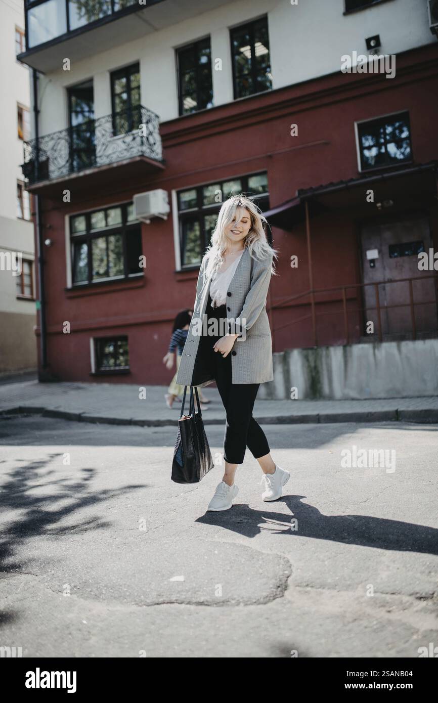 Self assured woman walks confidently hi-res stock photography and ...