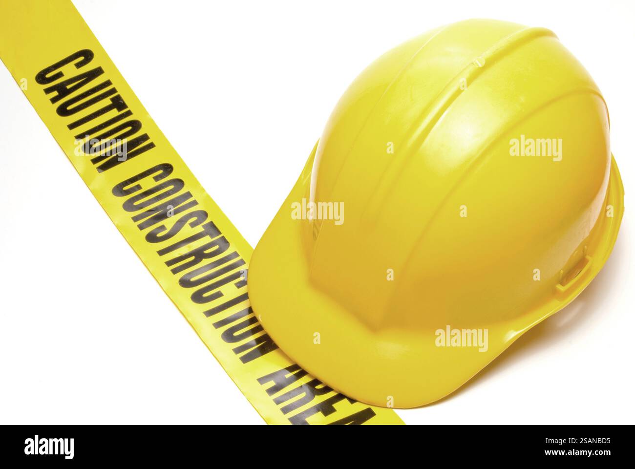 A Hard Hat on construction area tape Stock Photo - Alamy
