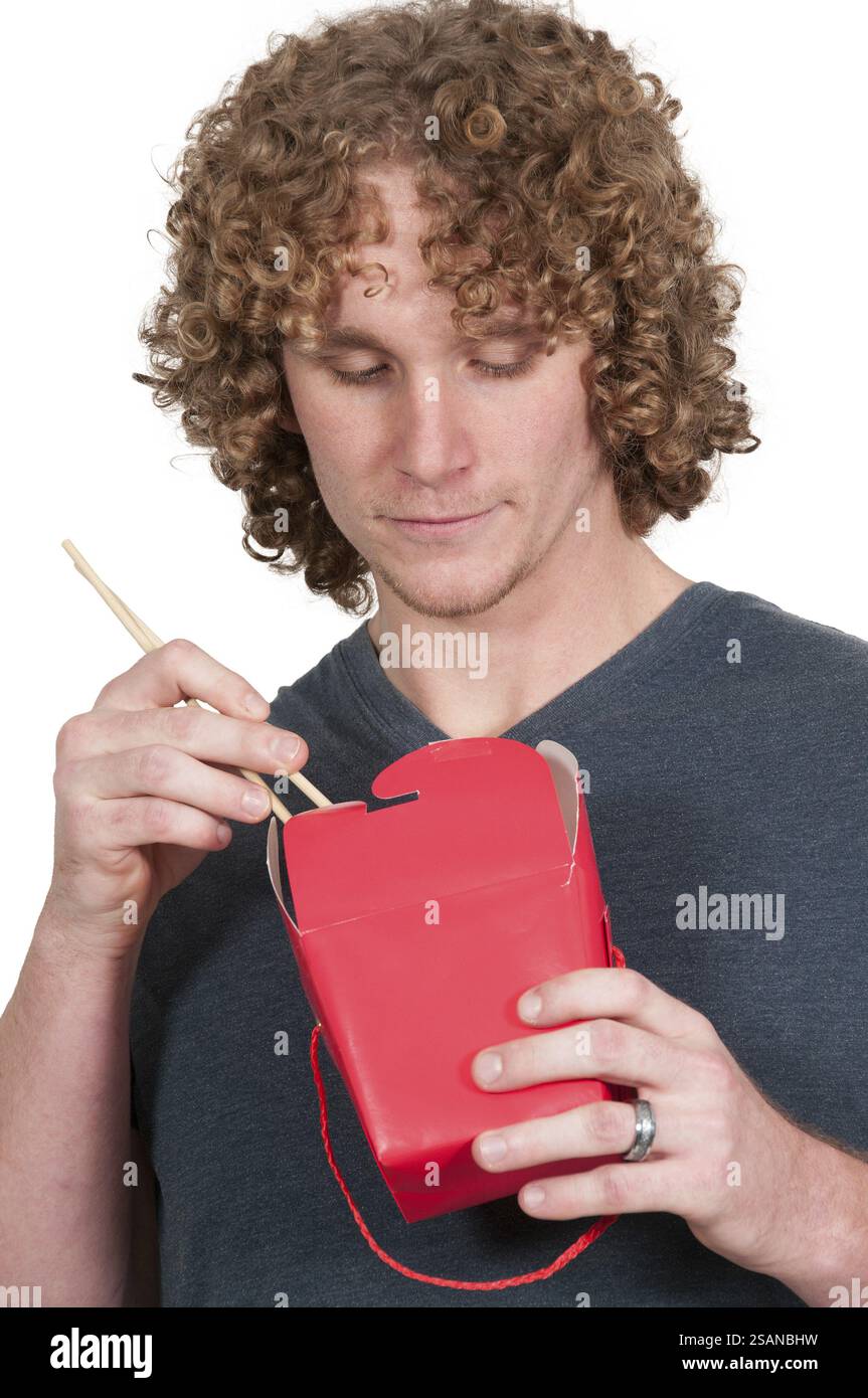 Black African American man eating Chinese or Japanese Asian food Stock ...