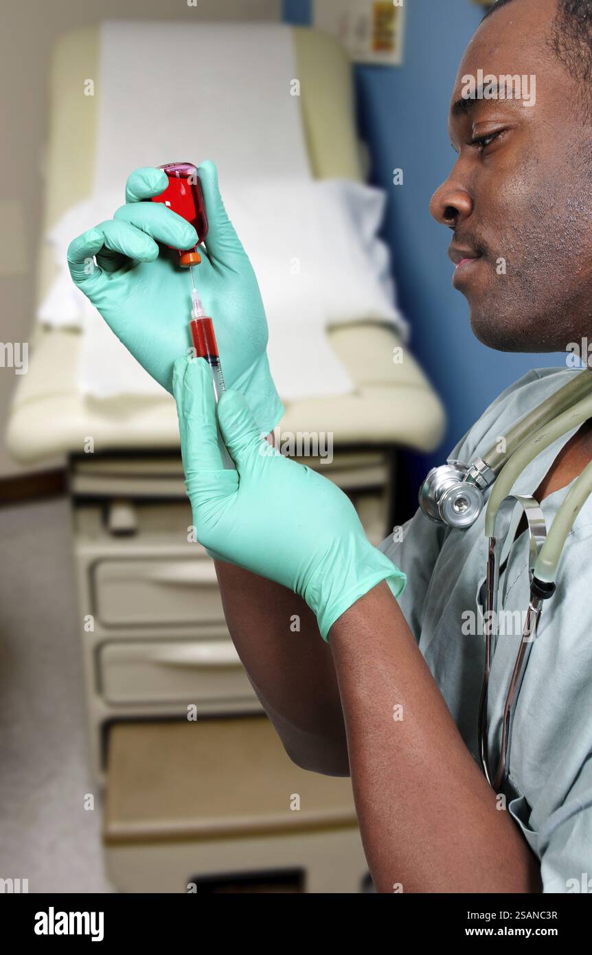 Black African American medical doctor preparing an injection in a ...