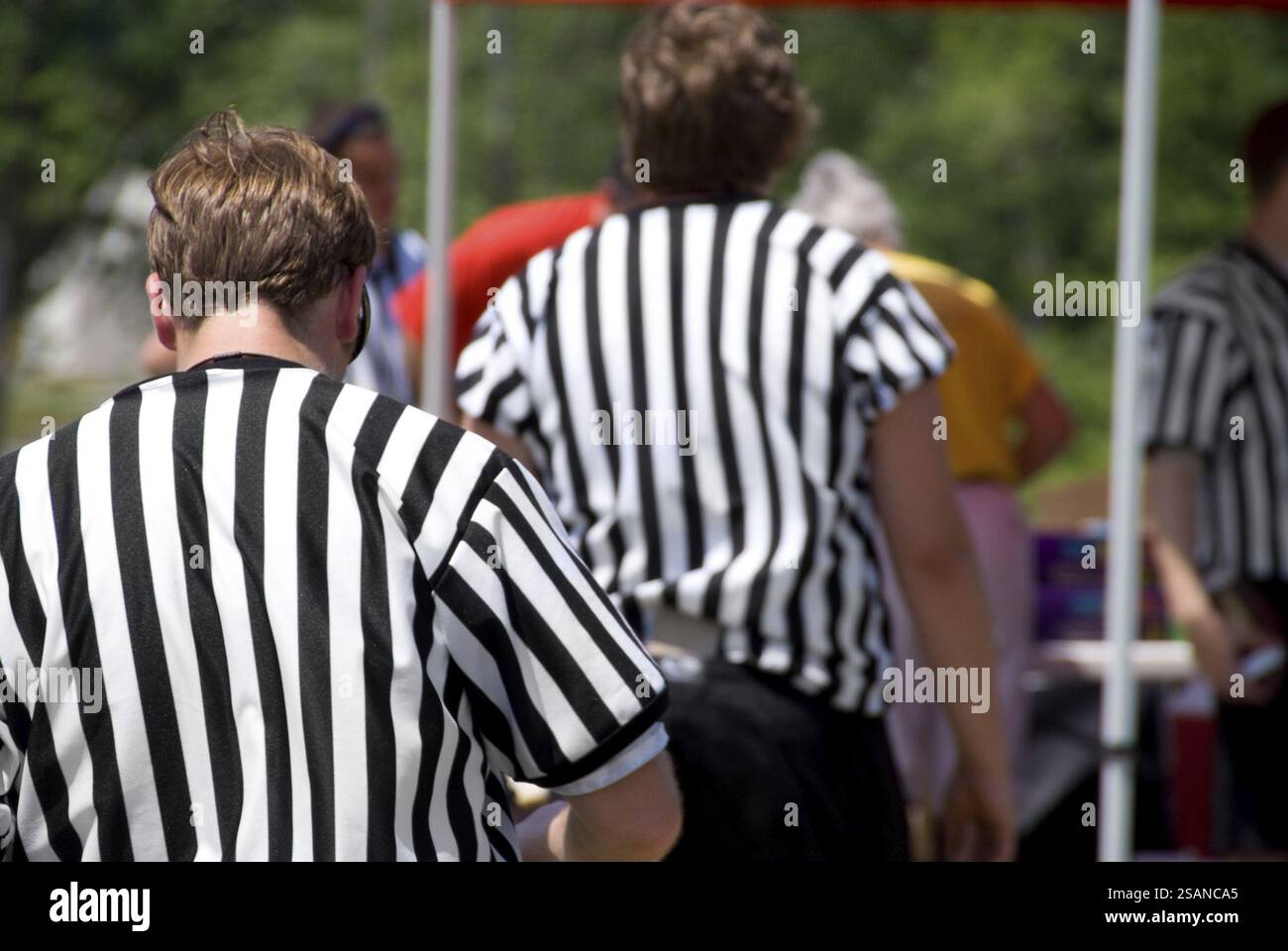 A sports referee wearing a traditional officials shirt Stock Photo - Alamy