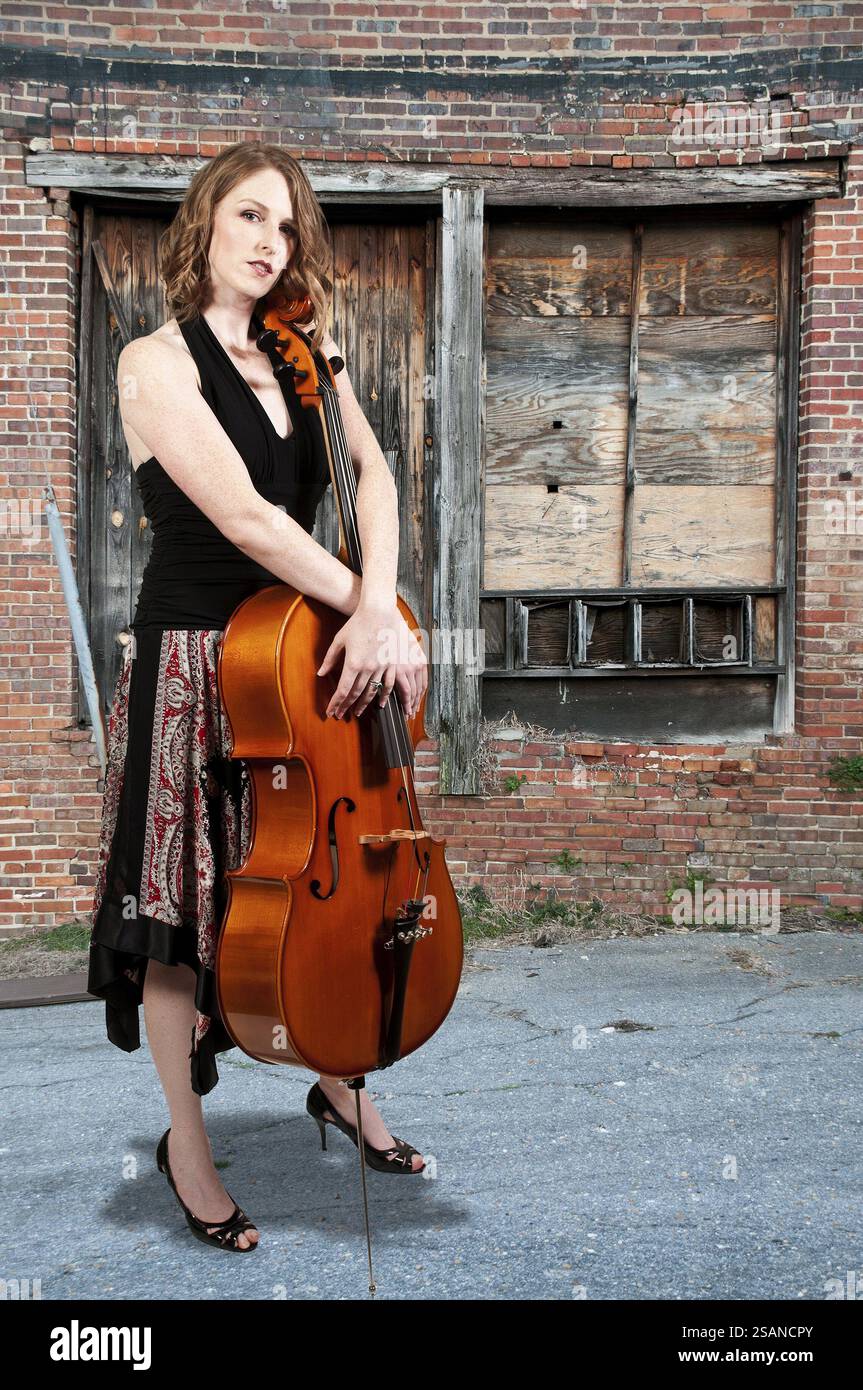 Beautiful woman cellist with her cello musical instrument Stock Photo ...