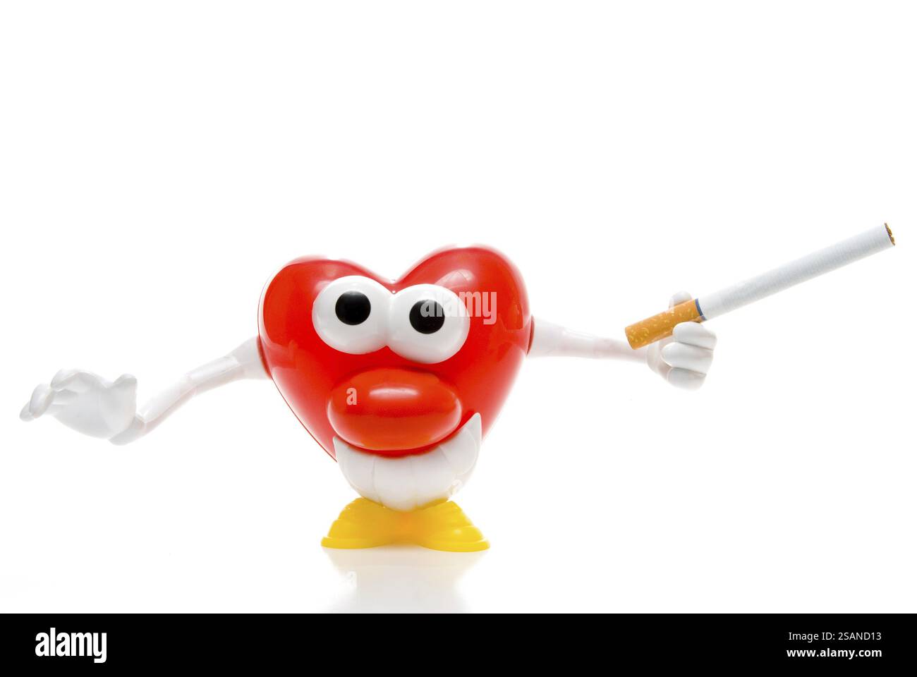 A smiling heart holding a tobacco cigarette Stock Photo - Alamy