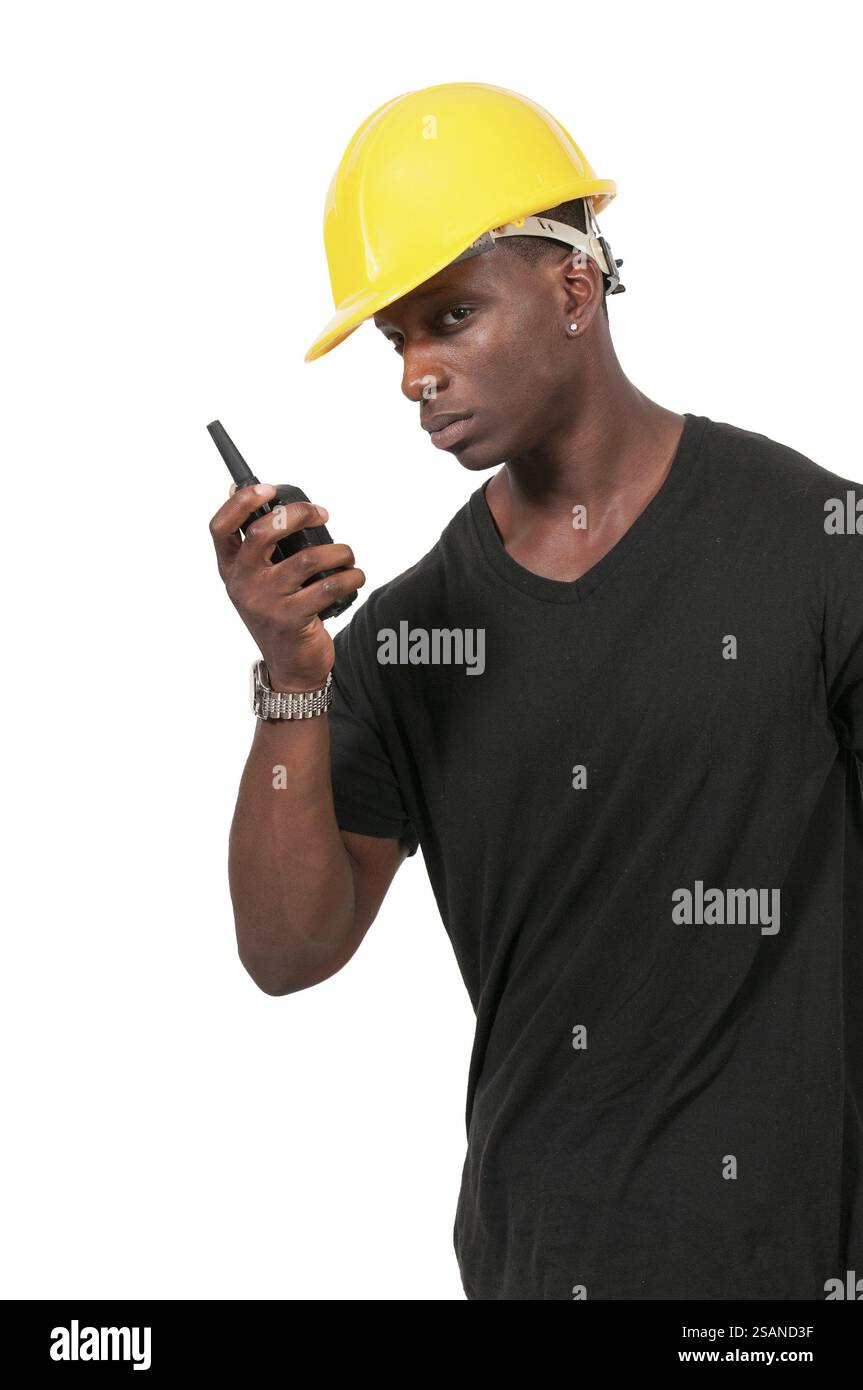 Handsome black man construction worker talking on a walkie talkie Stock ...