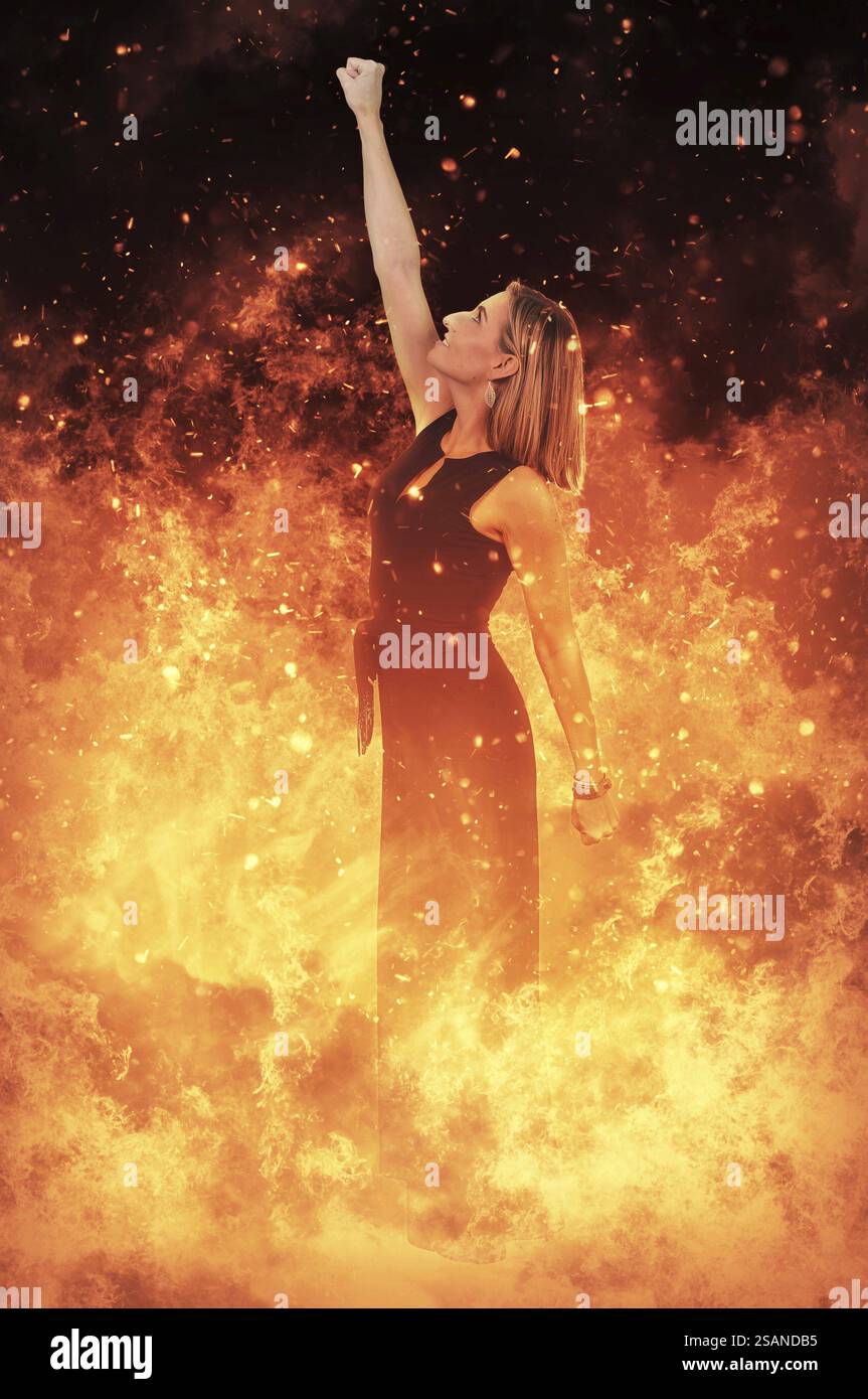 Beautiful woman standing in the midst of a fire Stock Photo - Alamy