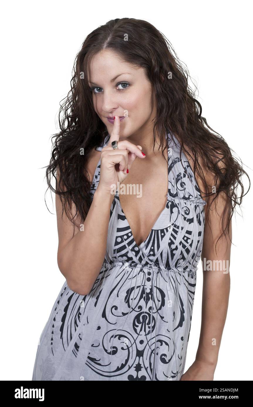 A woman saying be quiet by saying shhh Stock Photo - Alamy