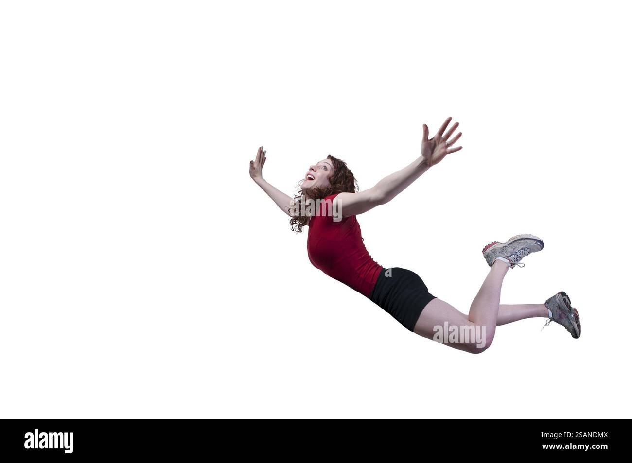 A beautiful young woman falling through the sky Stock Photo - Alamy