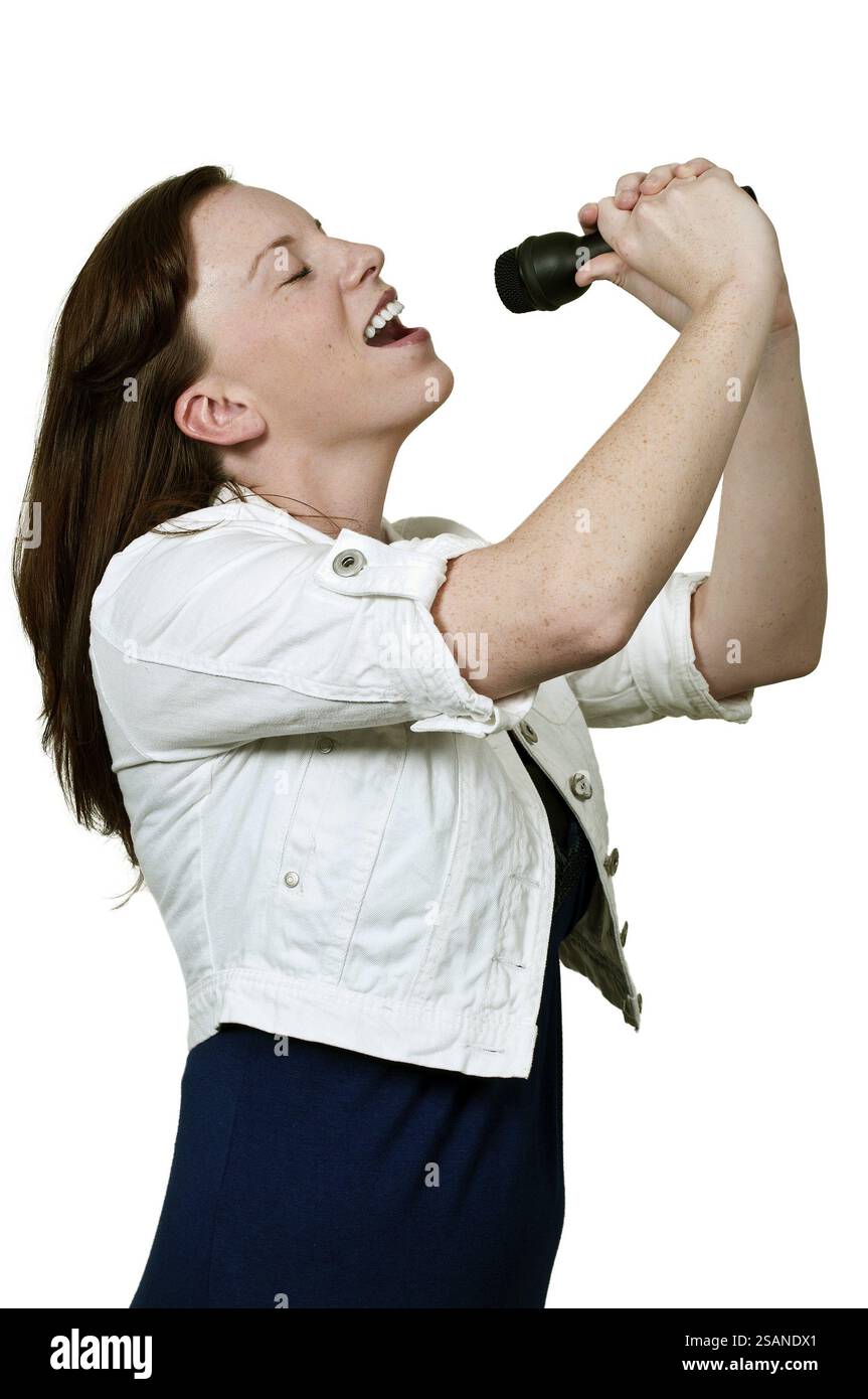 A beautiful woman singer performing at a concert Stock Photo - Alamy