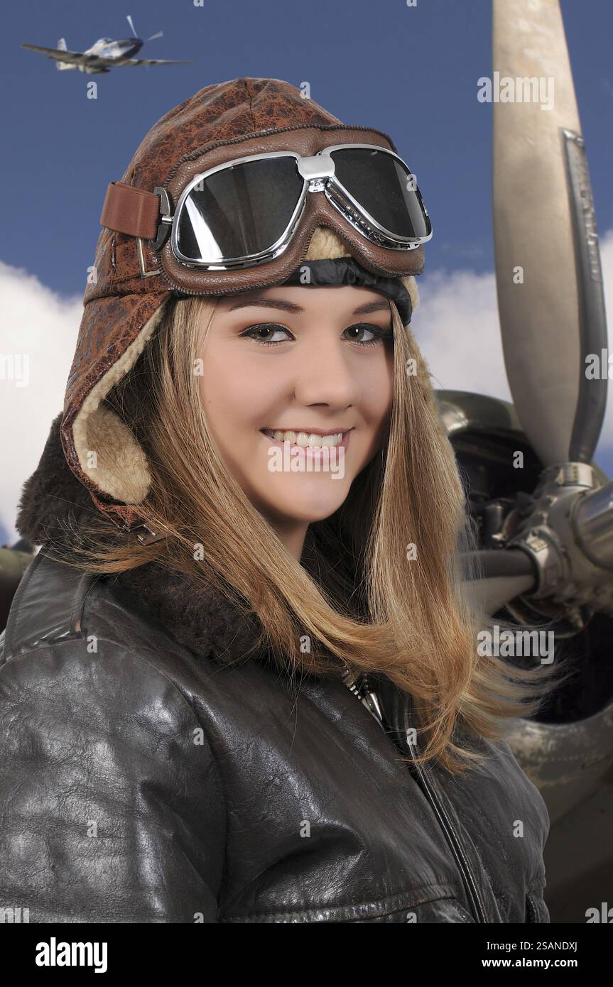 Woman pilot wearing vintage pilot helmet flight jacket and goggles ...