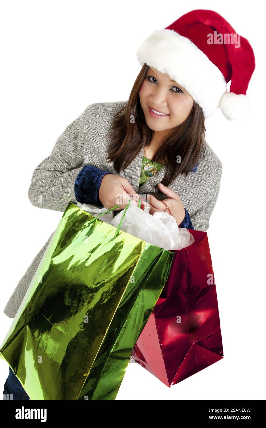 A beautiful young woman on a Christmas shopping spree Stock Photo - Alamy