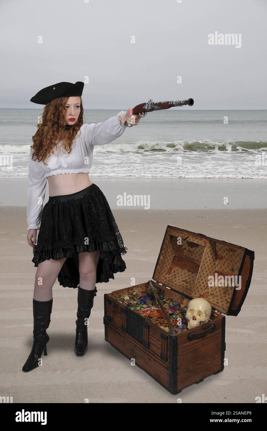 Young beautiful pirate woman with a flintlock pistol Stock Photo - Alamy