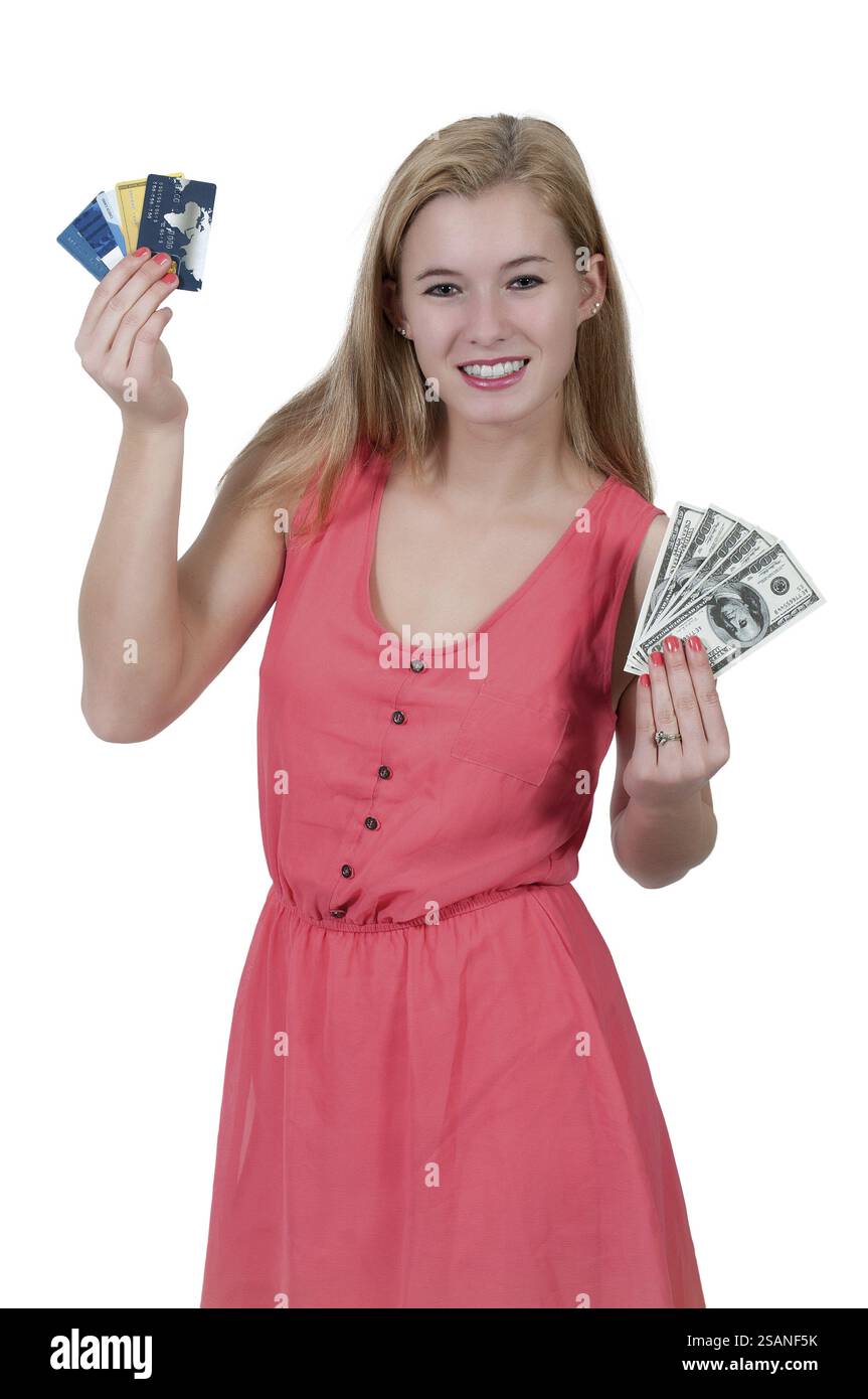 Beautiful woman holding a hand full of 100 dollar bills and credit ...