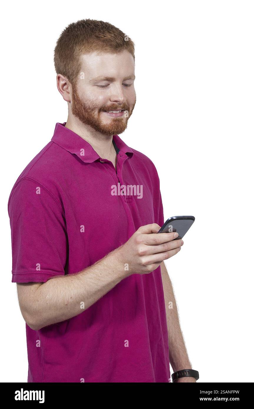 Handsome man using a cell phone for texting Stock Photo - Alamy
