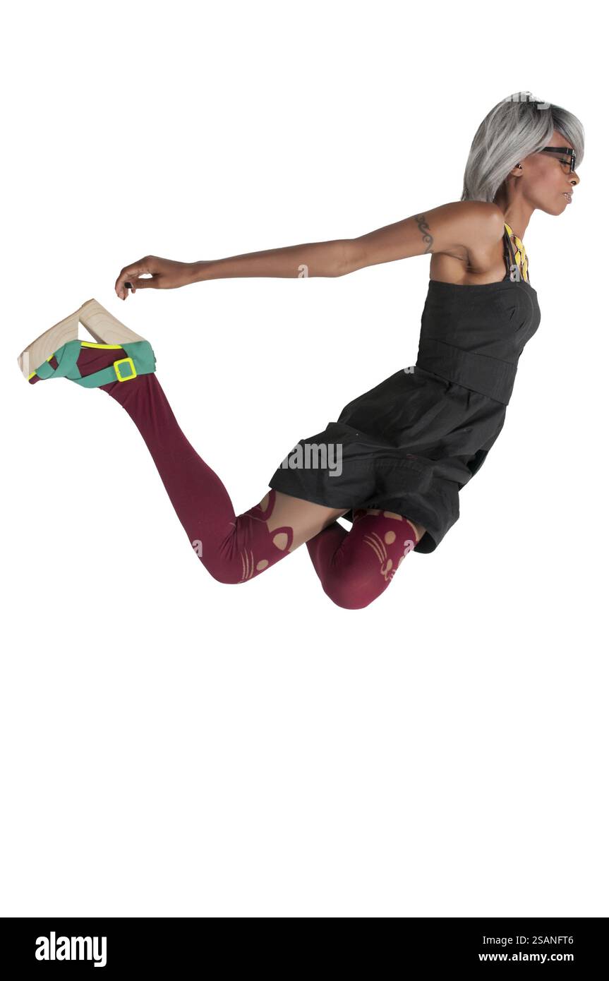 Beautiful young woman falling through the sky Stock Photo - Alamy