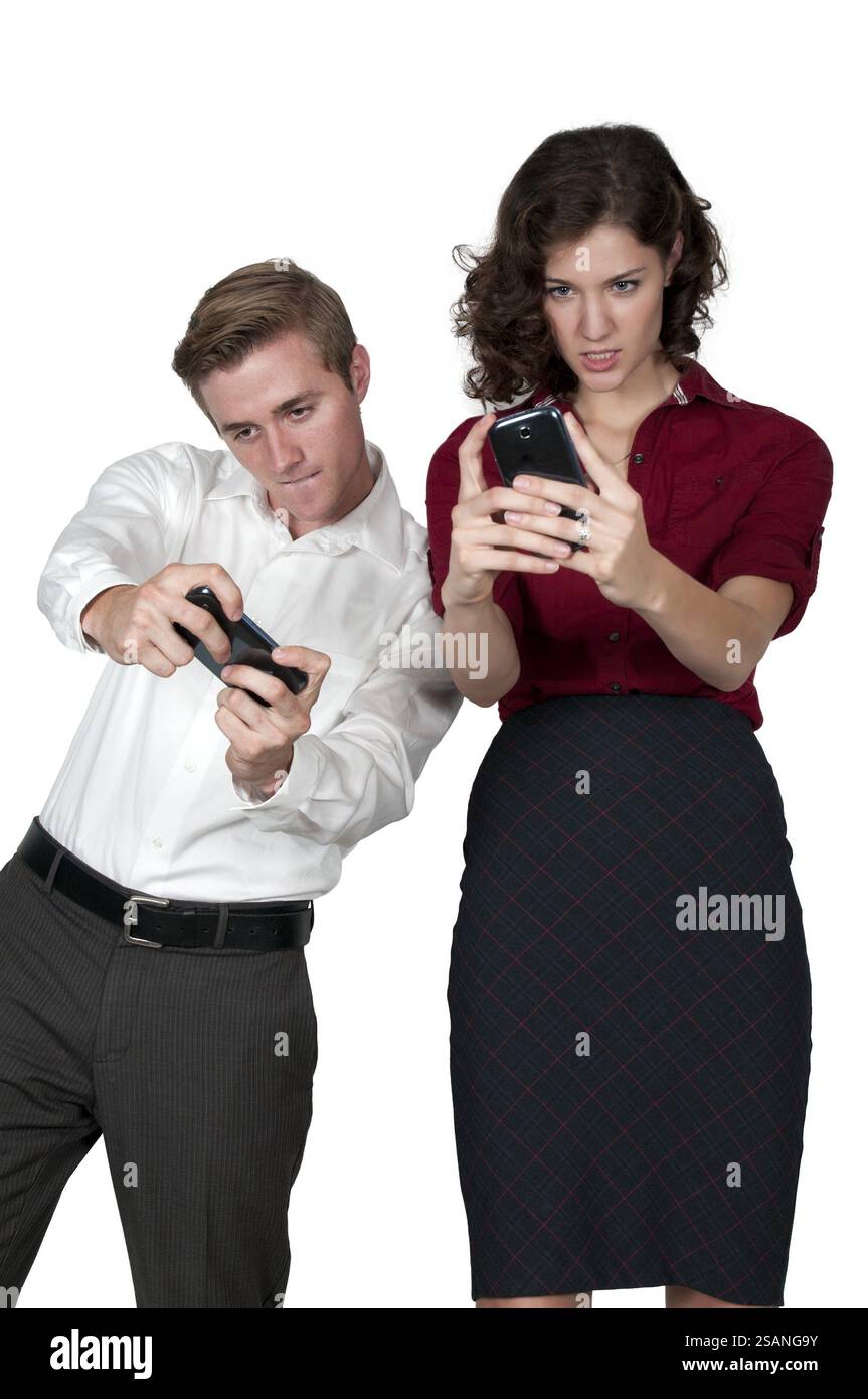 Couple playing video games on their smart phones Stock Photo - Alamy