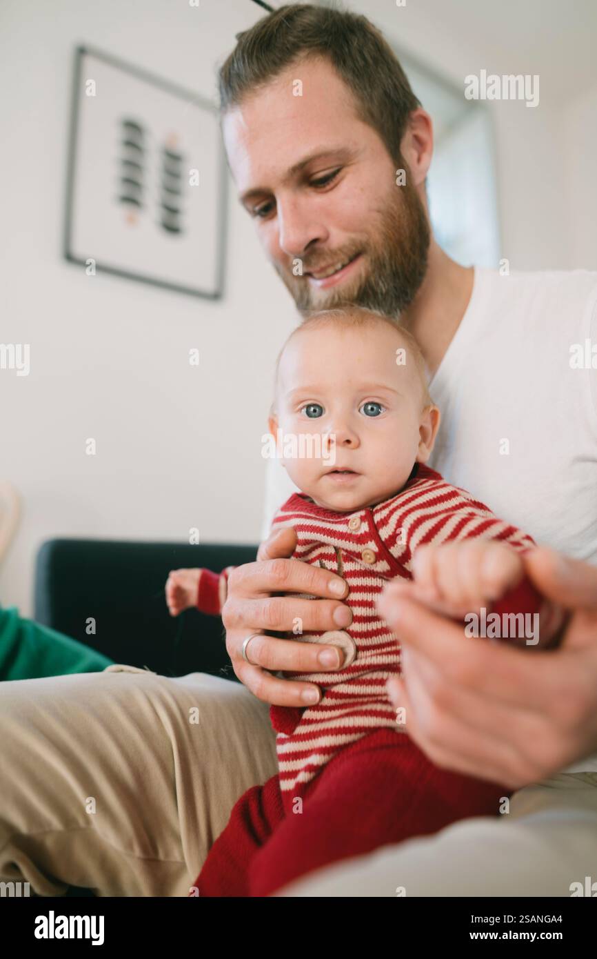 A heartwarming moment of bonding between a father and his baby takes ...