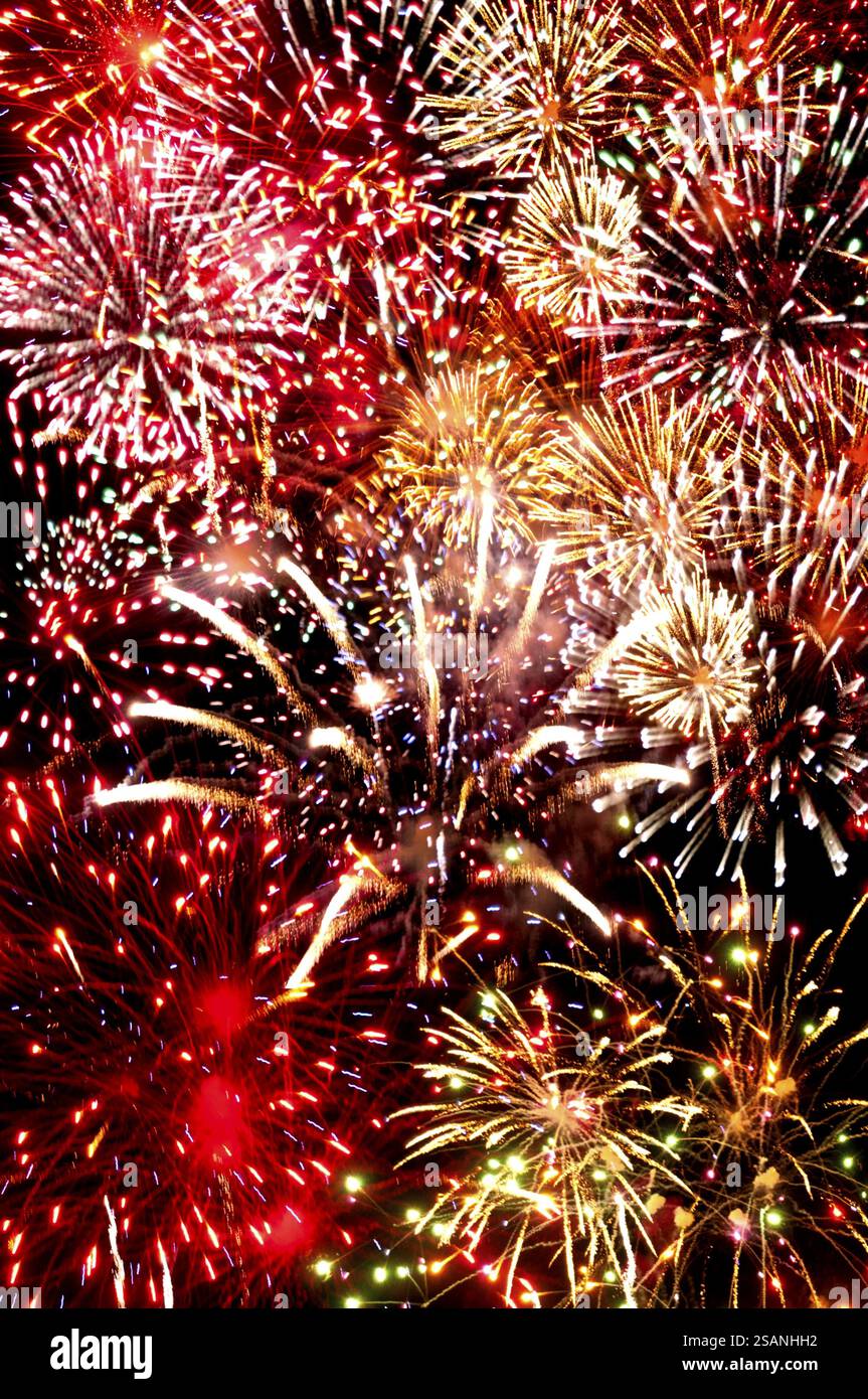 Fireworks exploding in the dark of the evening sky Stock Photo - Alamy